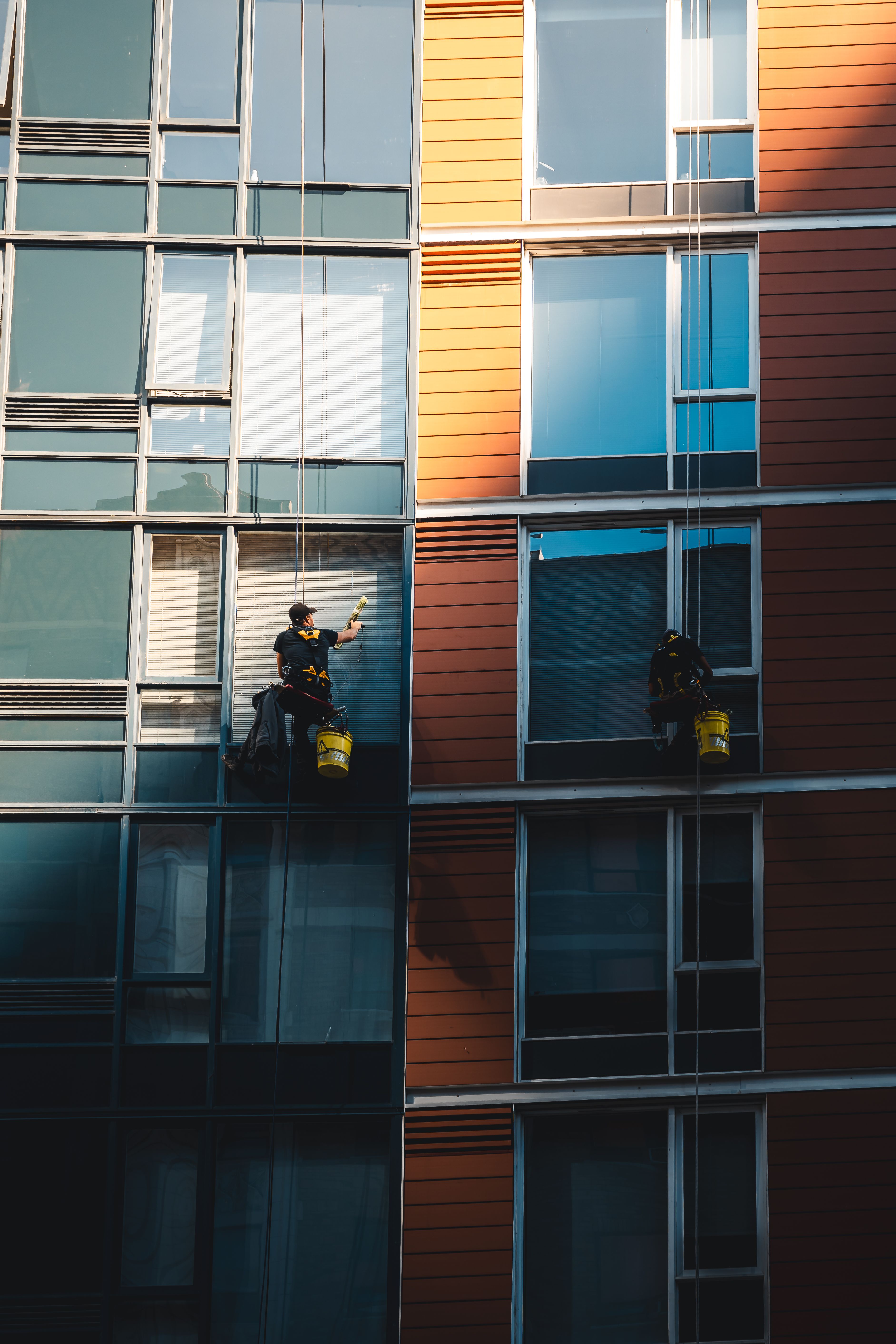 A Man Cleaning the Windows of a Skyscraper on a High Floor · Free Stock ...