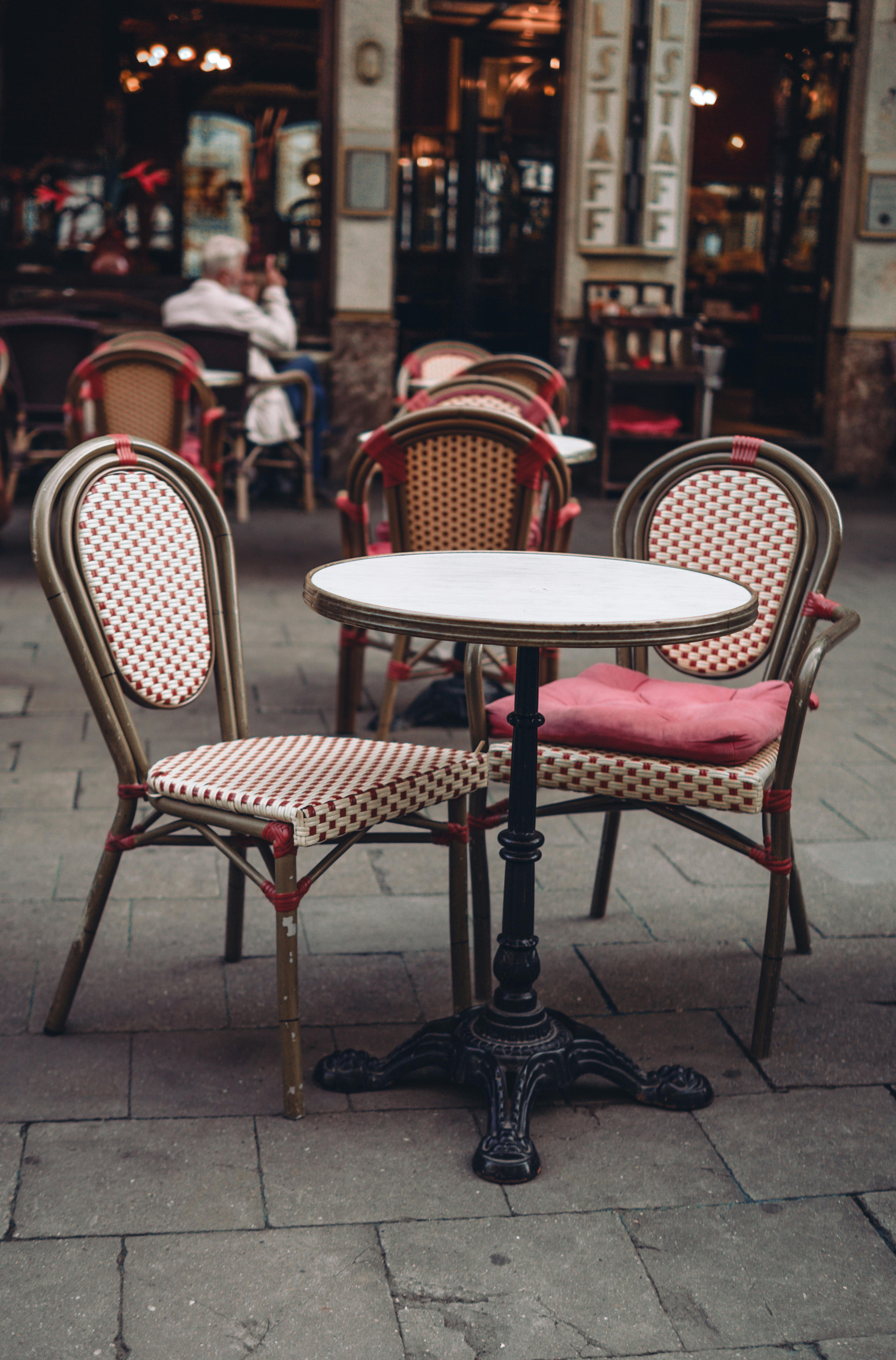Restaurant Table and Chairs on Pavement · Free Stock Photo