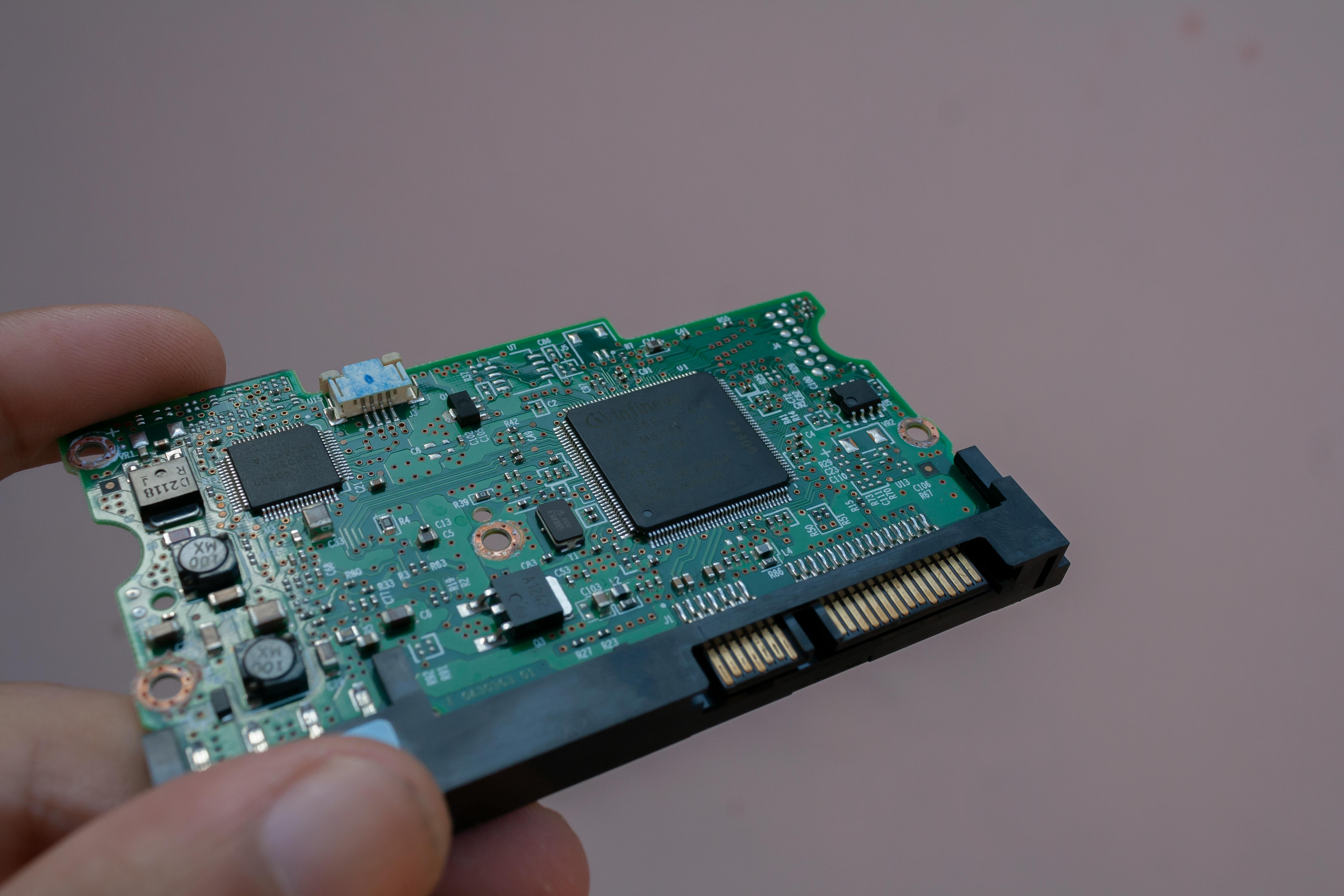 Close-up of a Person Holding a Computer Component · Free Stock Photo