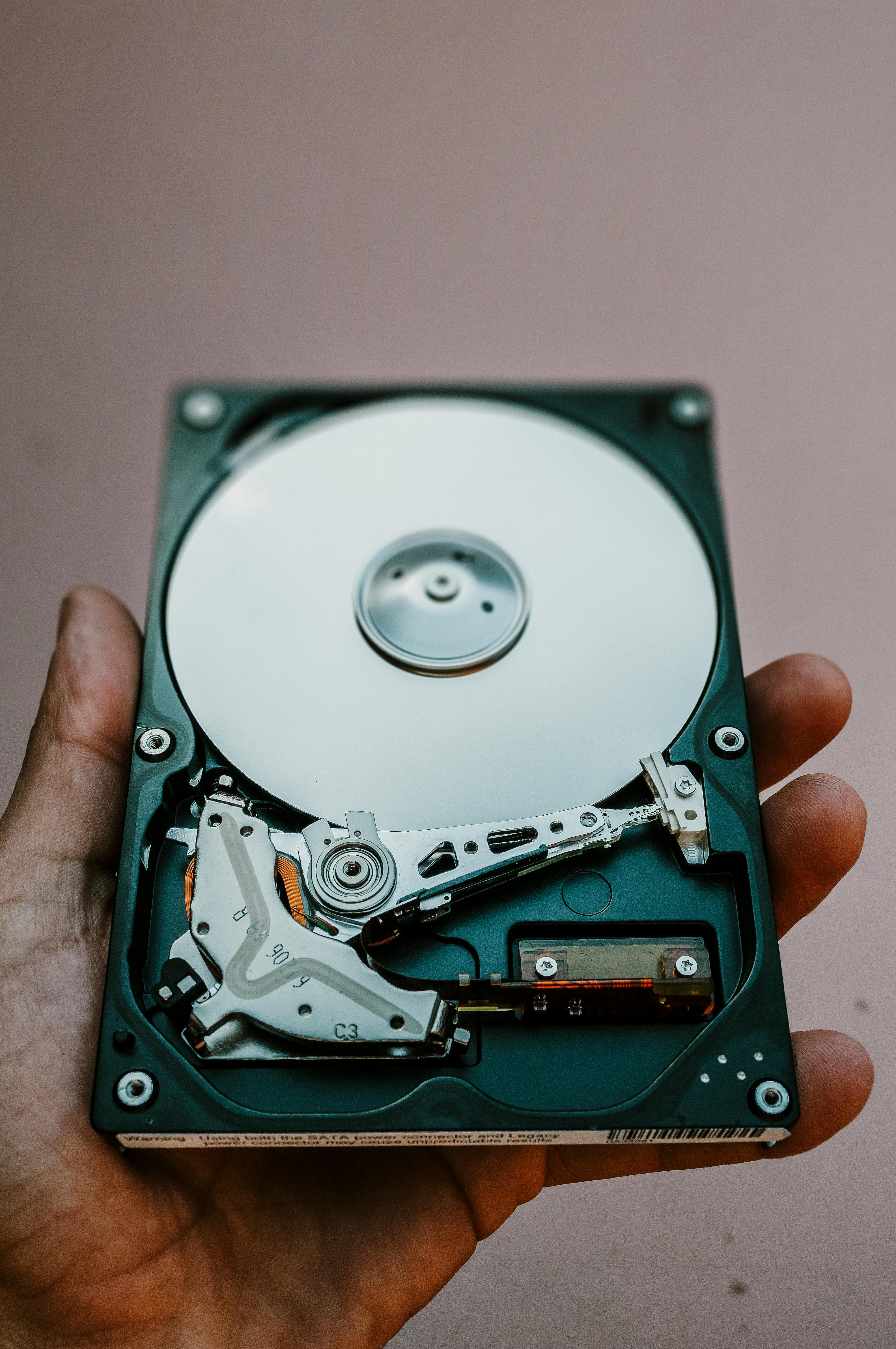 Opened Hard Drive Disk in Hand · Free Stock Photo