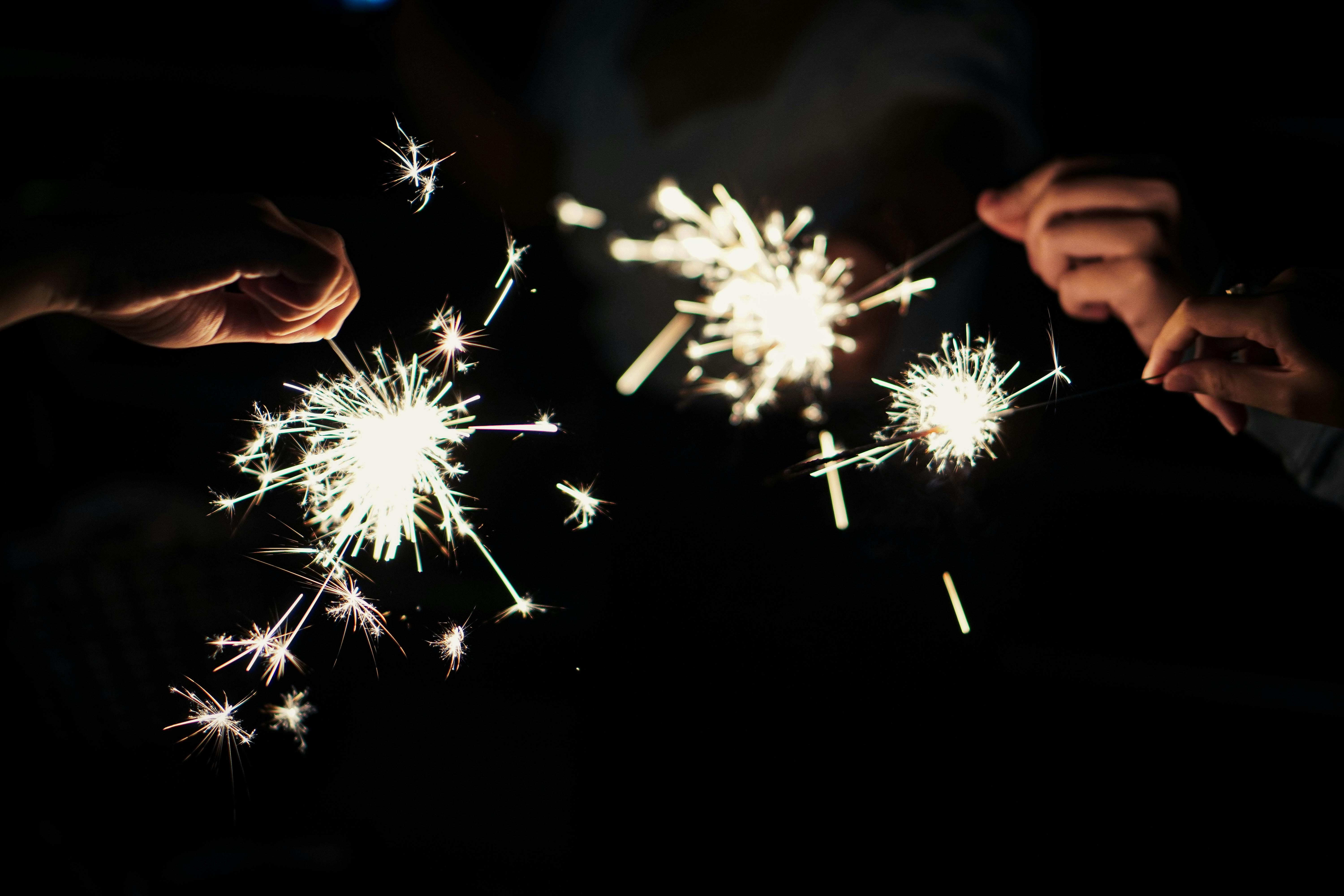 People Lighting Sparklers · Free Stock Photo