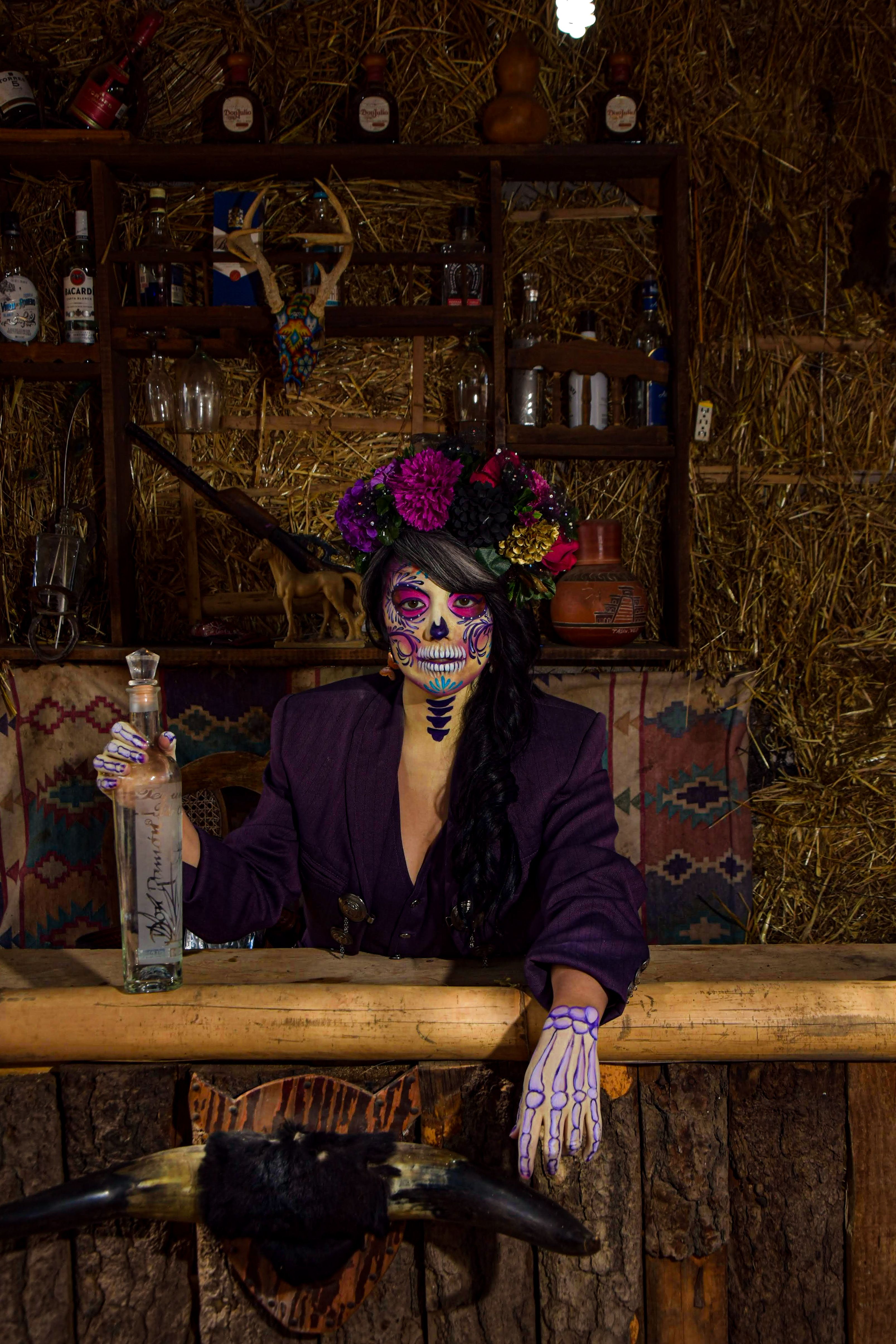 Model in Catrina Costume in Bar · Free Stock Photo