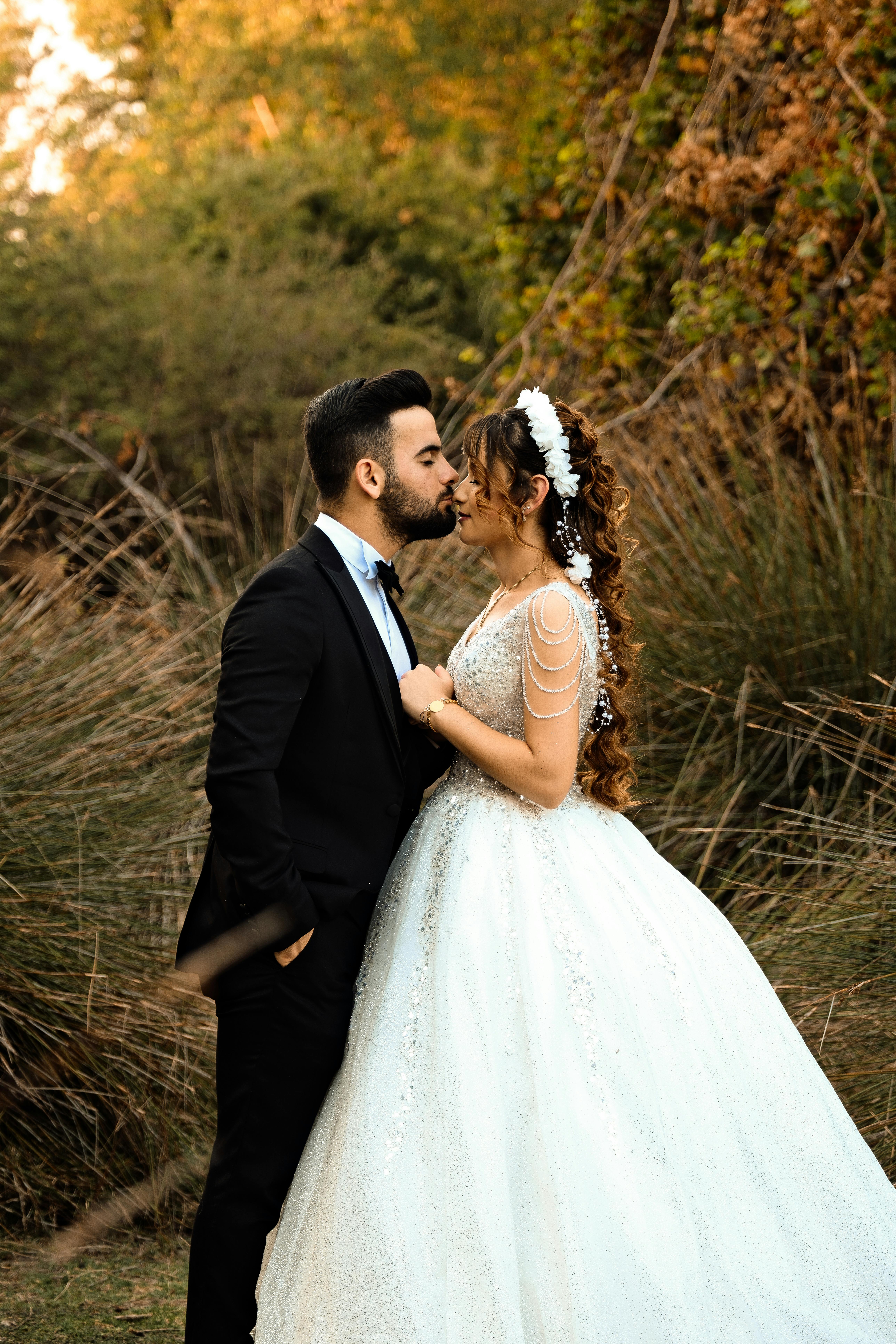 Groom Kissing the Bride on the Nose · Free Stock Photo