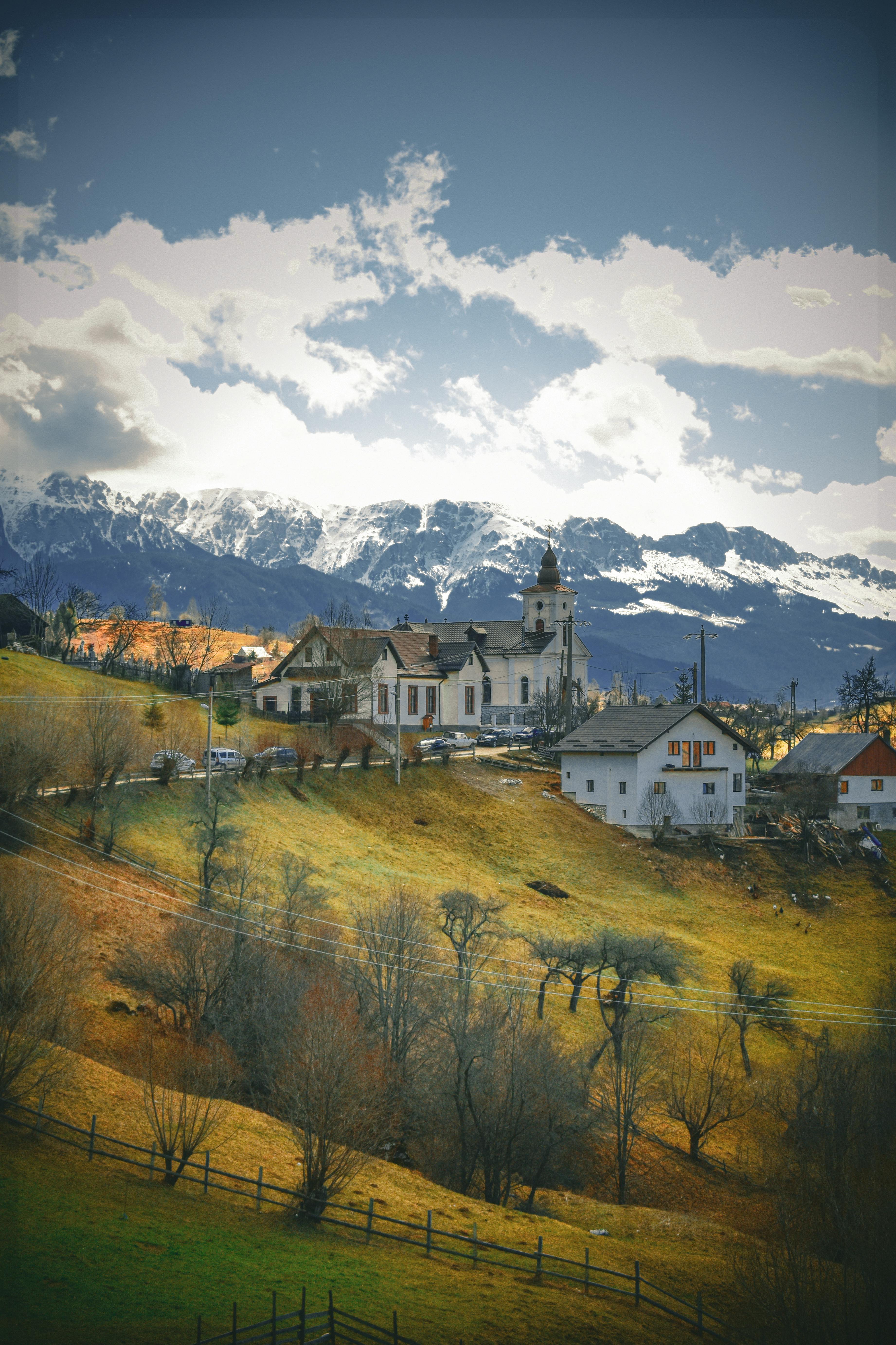 Small Town Set in Idyllic Mountainous Landscape · Free Stock Photo