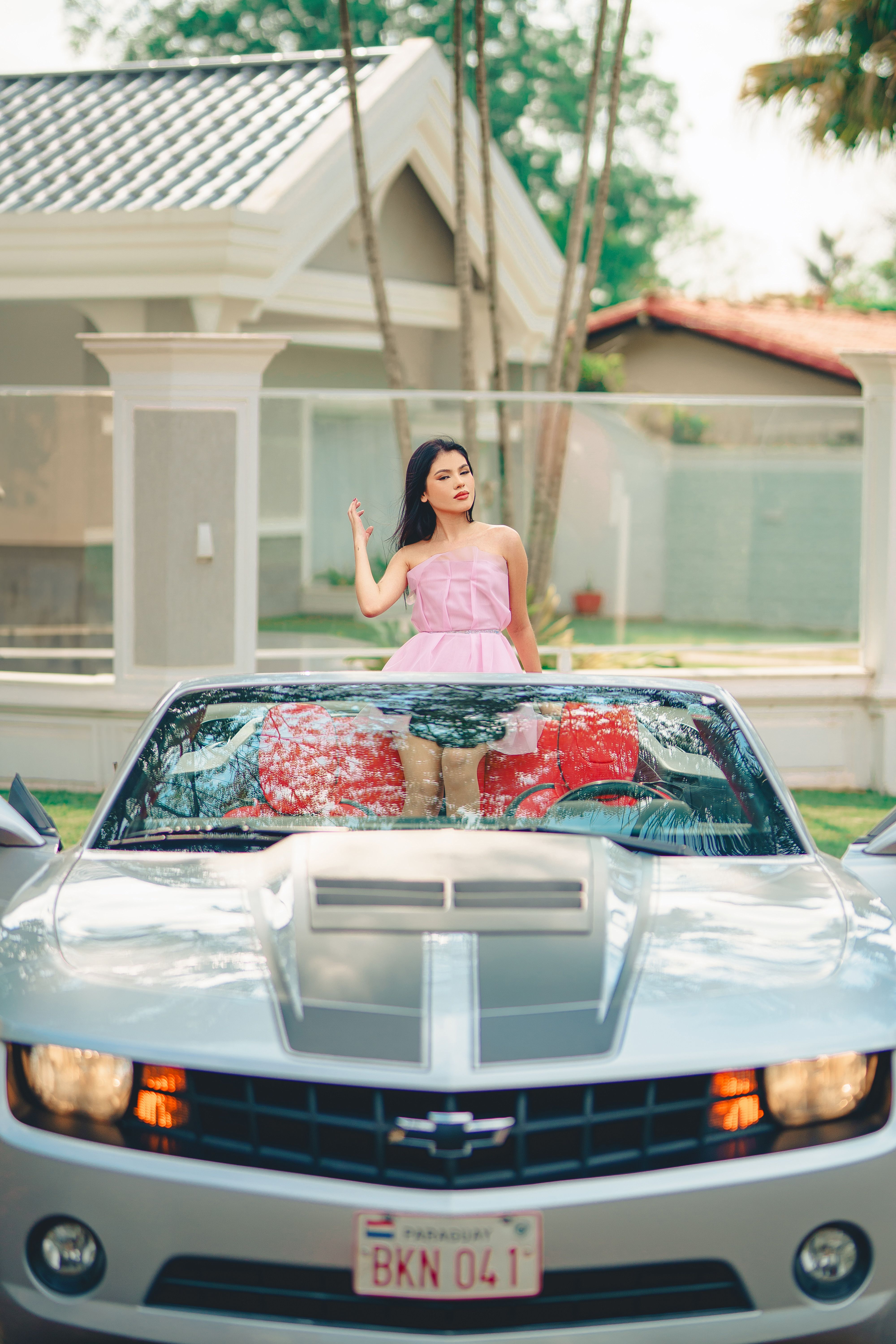 Woman Sitting in a Chevrolet · Free Stock Photo
