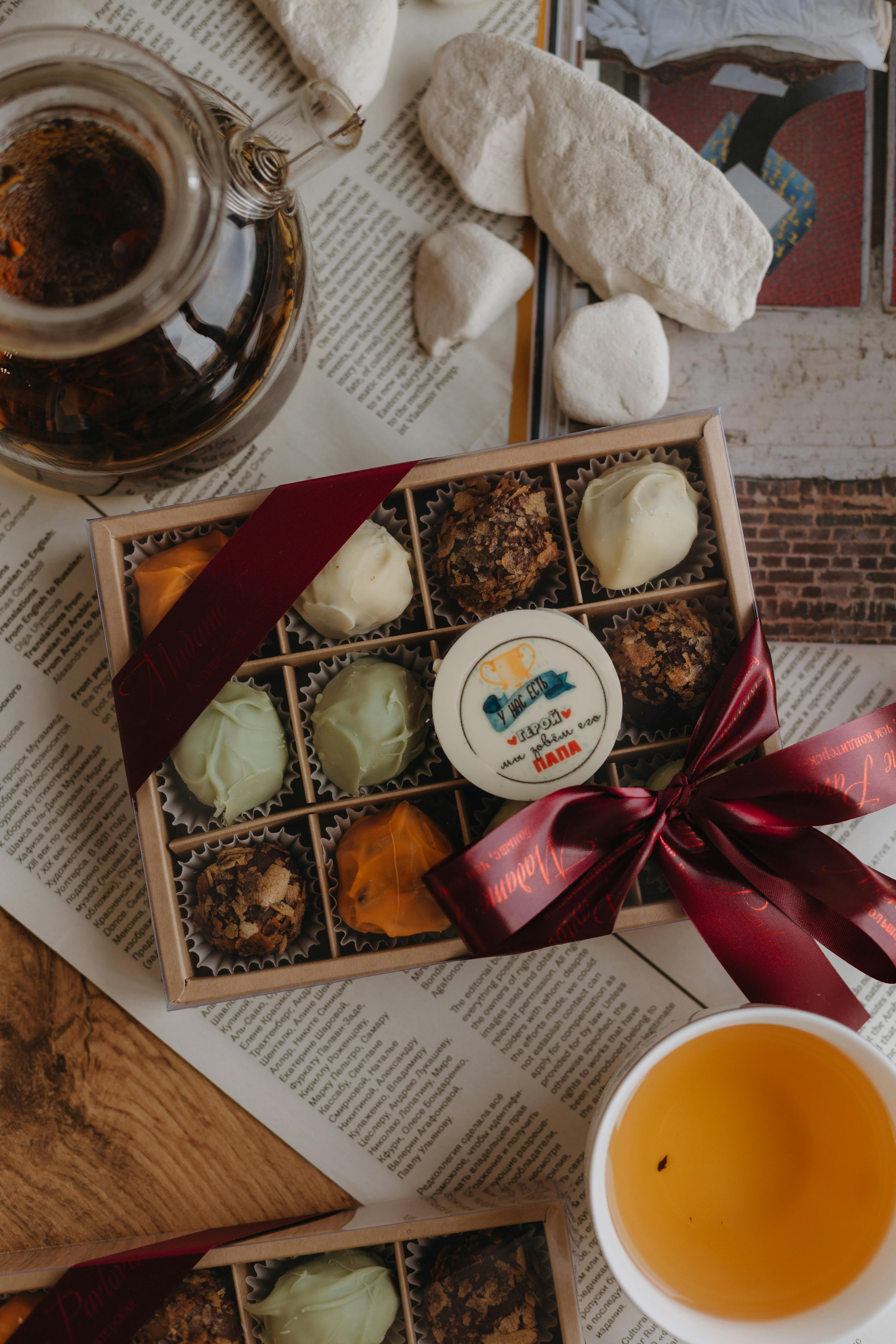 Box of Pralines and Tea on the Table · Free Stock Photo