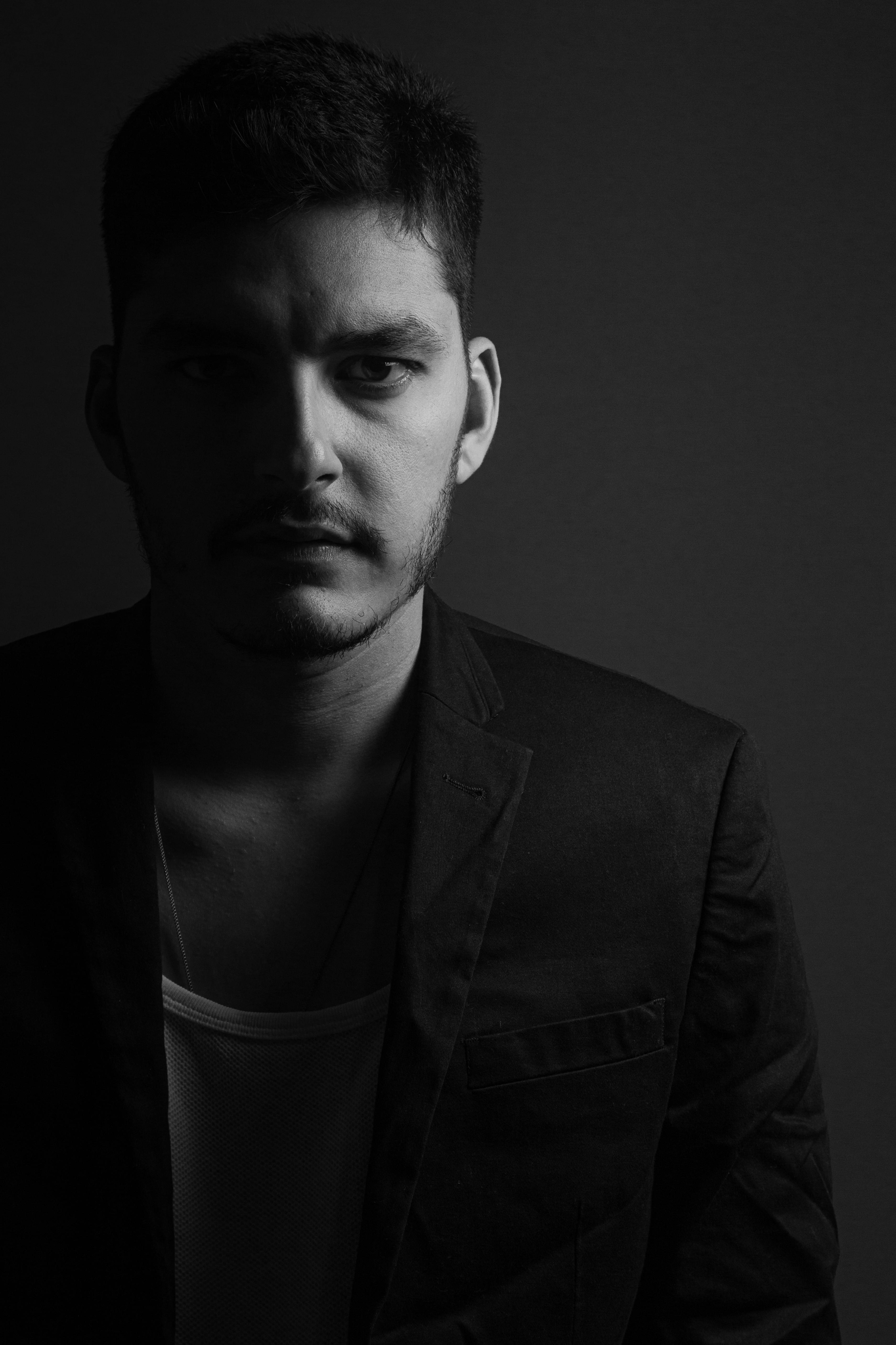 Portrait of Man in Shadow in Black and White · Free Stock Photo