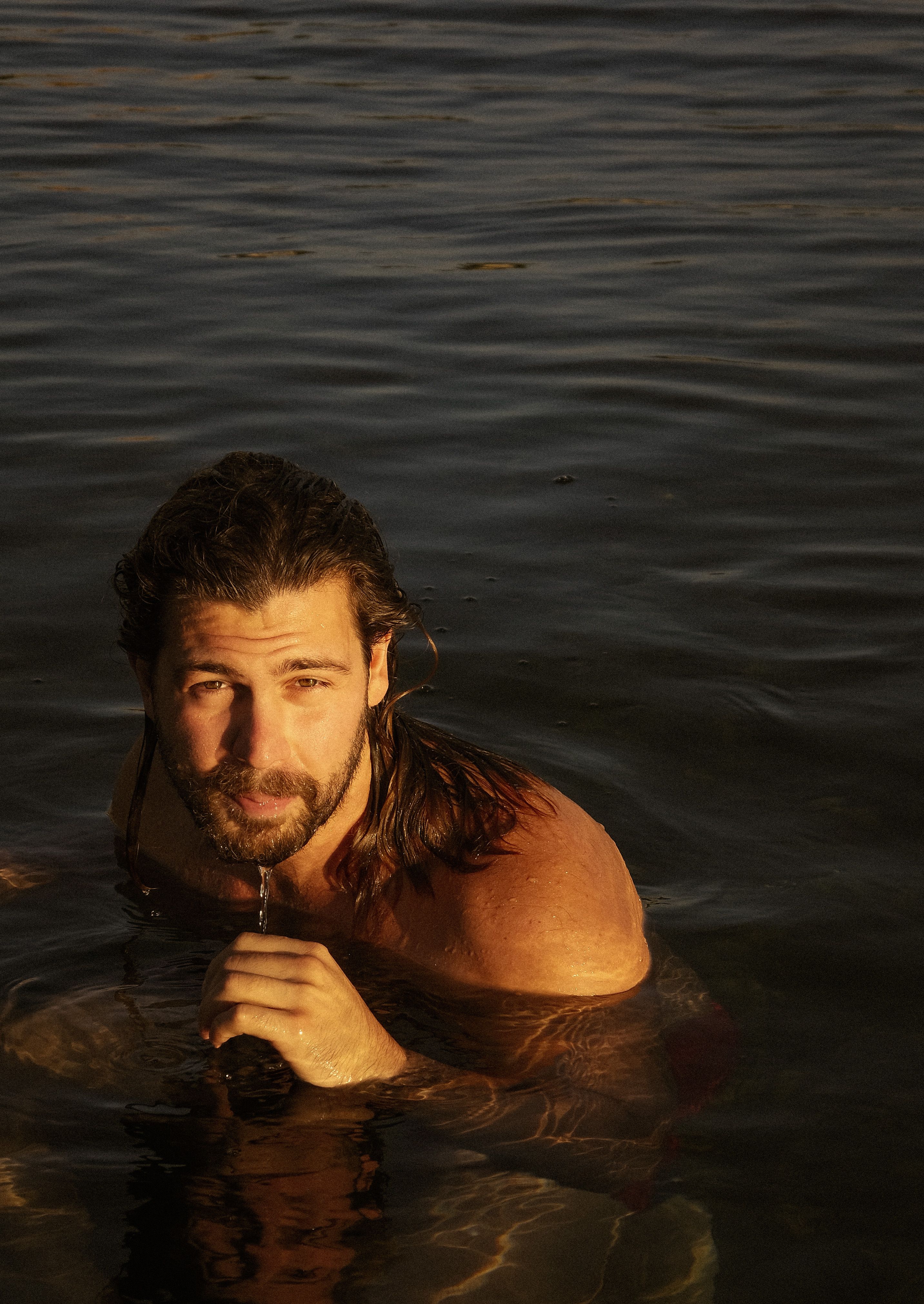 Sunlit Man in Water · Free Stock Photo