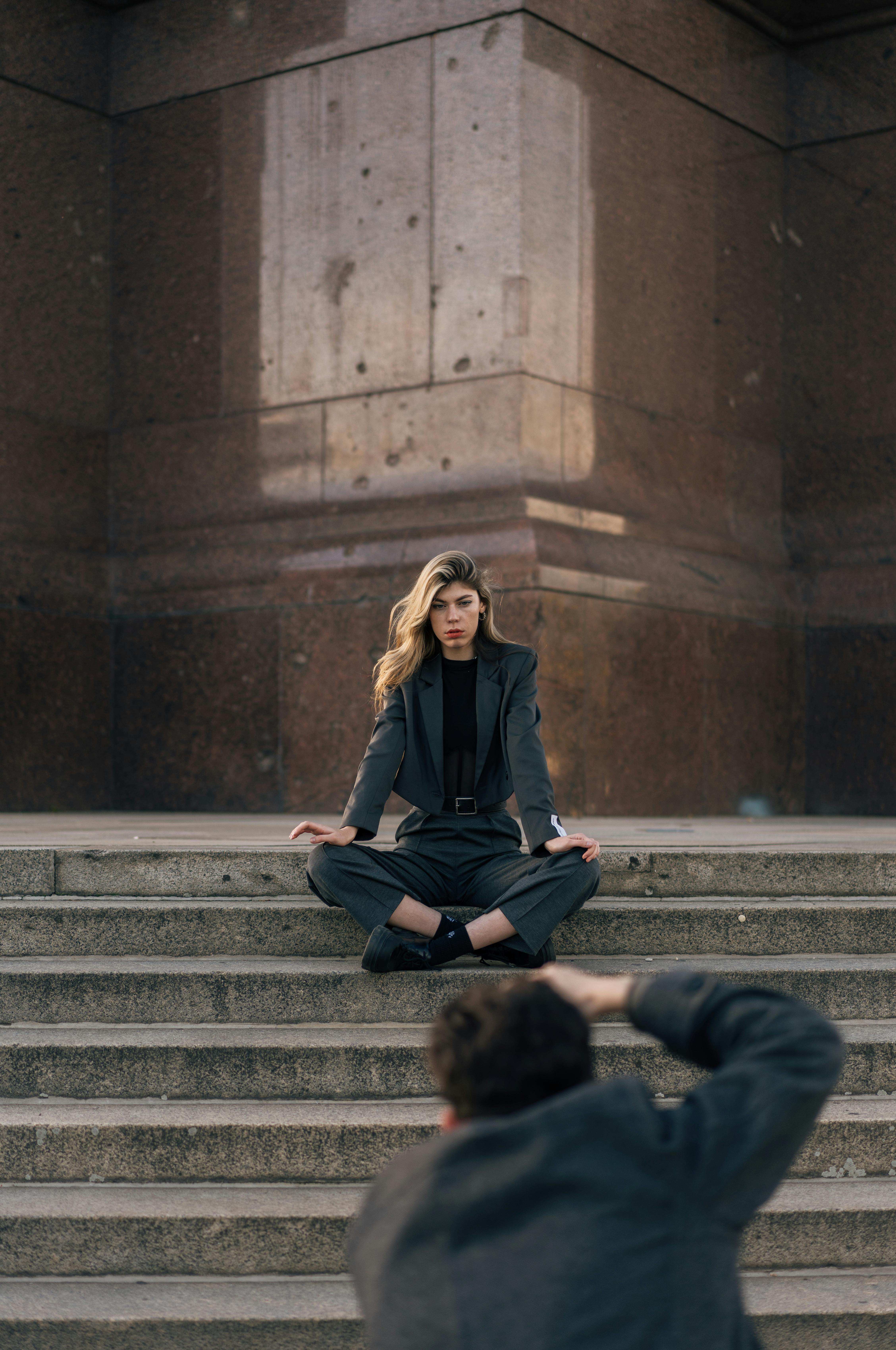Female Model during a Photo Shoot on Outdoor Steps · Free Stock Photo
