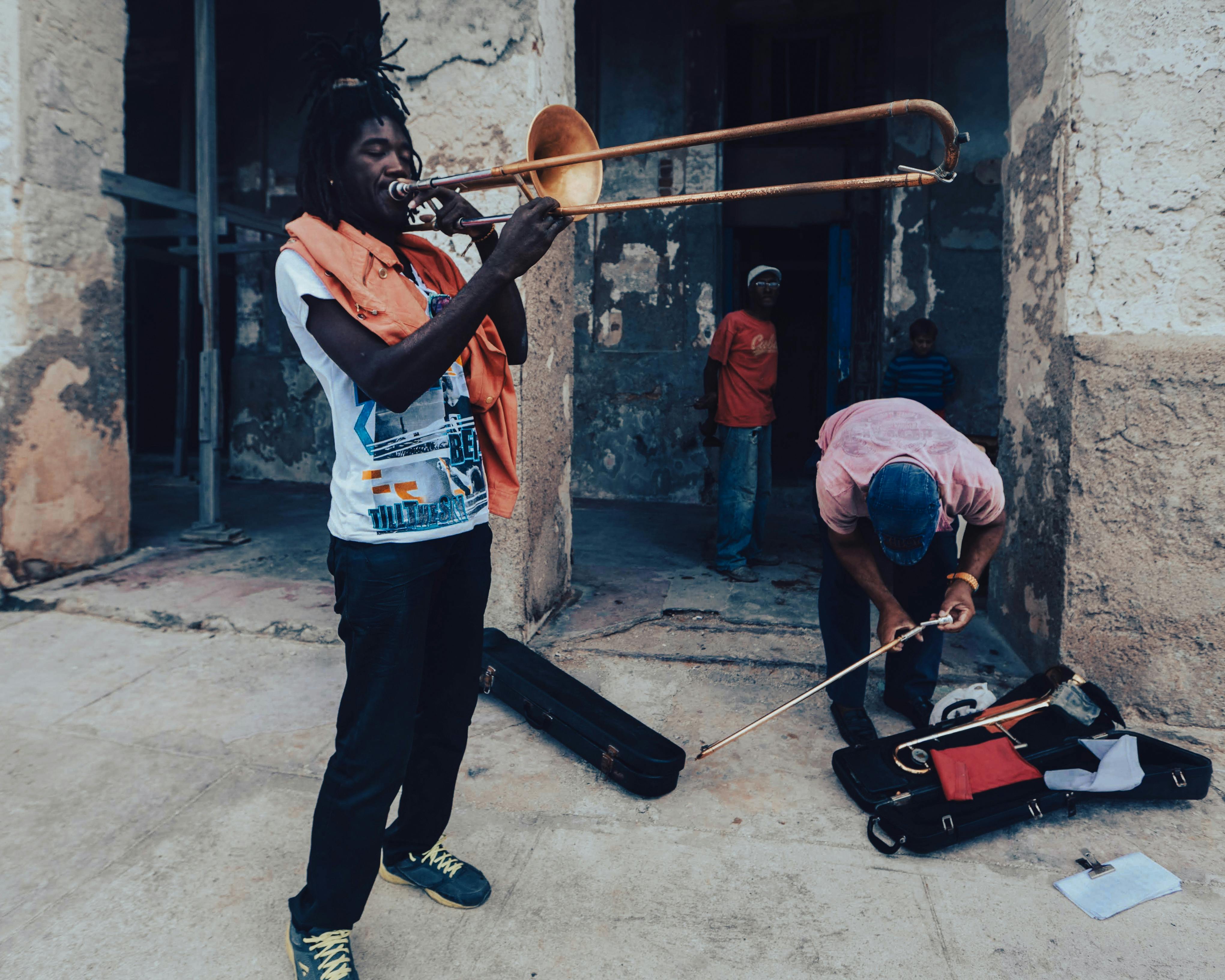 African Men Playing on Instruments on a Street · Free Stock Photo