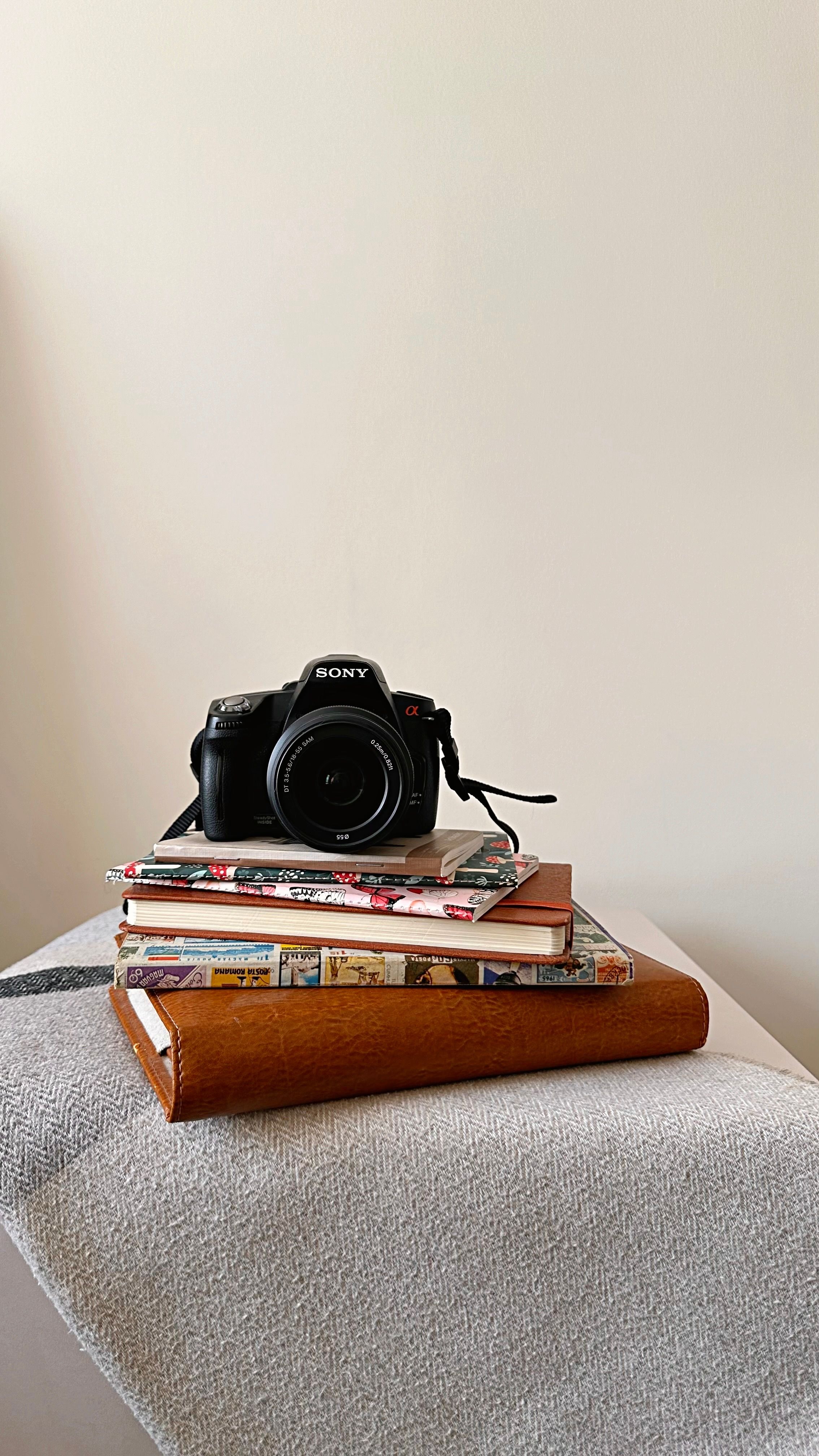 Camera on Books on Cloth · Free Stock Photo