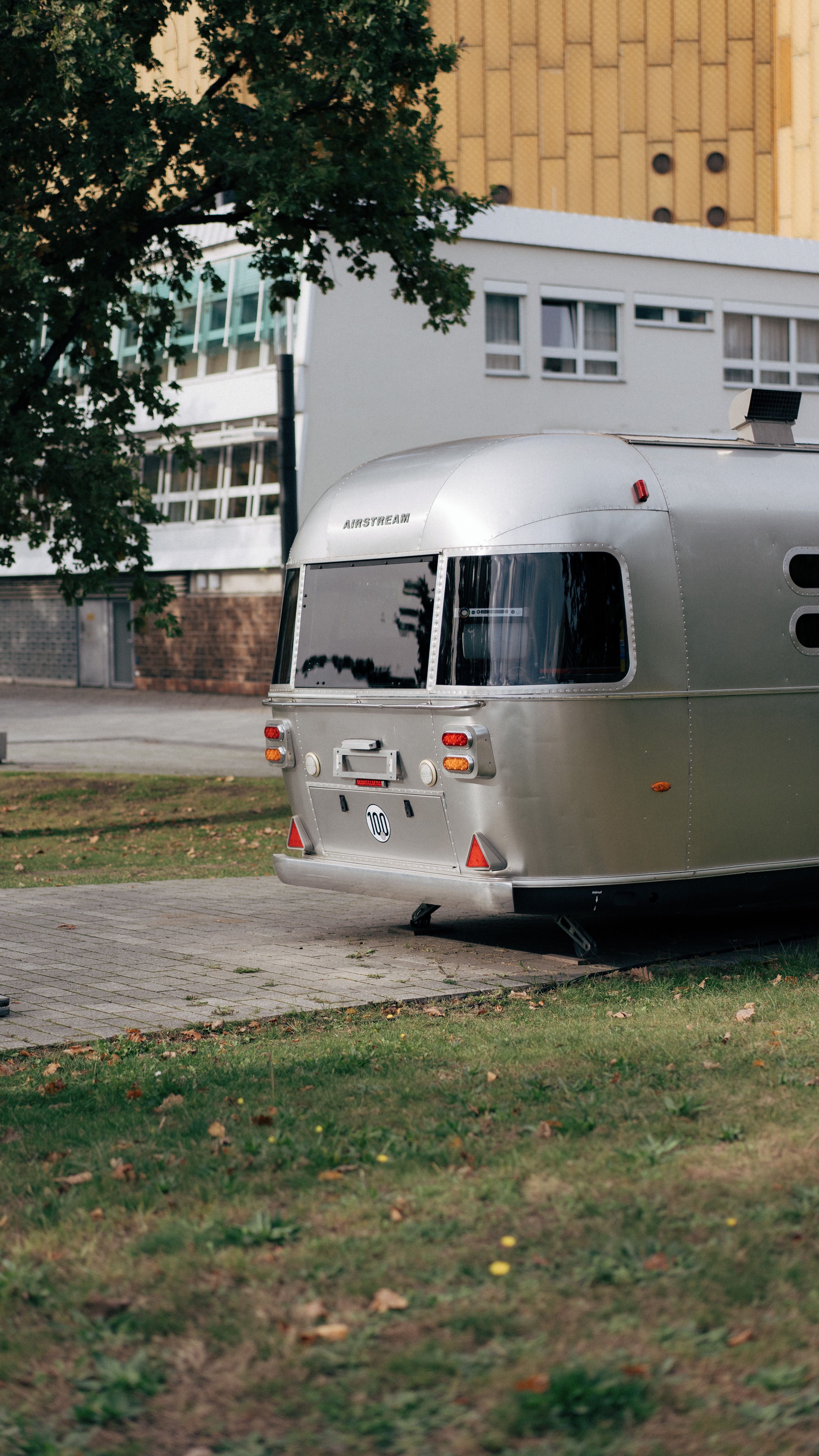 Metal Trailer Parked by Building · Free Stock Photo