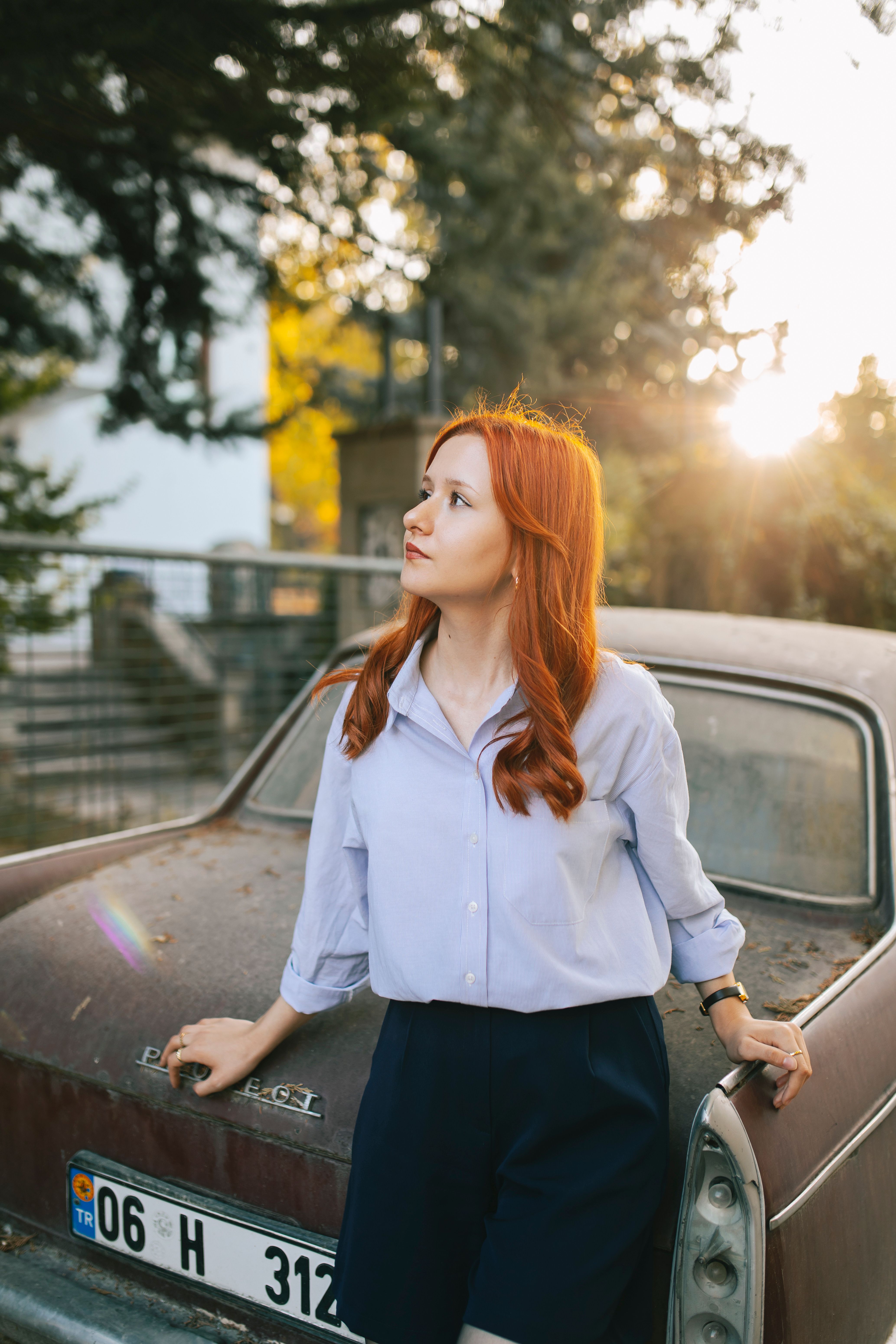 Model in a Purple Blouse and Navy Blue Mini Skirt in the Setting Sun ...
