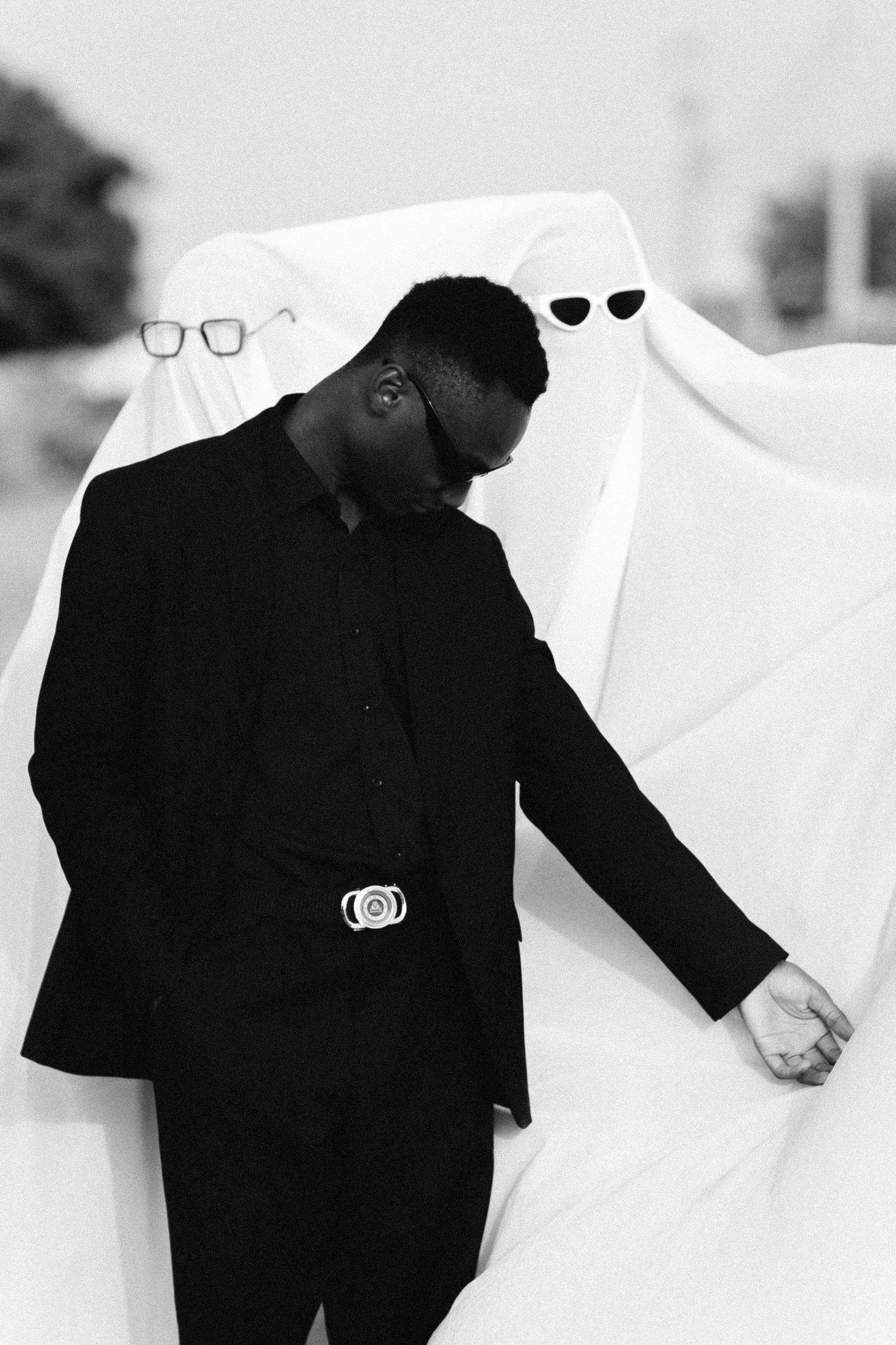 Man in Black Suit Touching Ghosts · Free Stock Photo