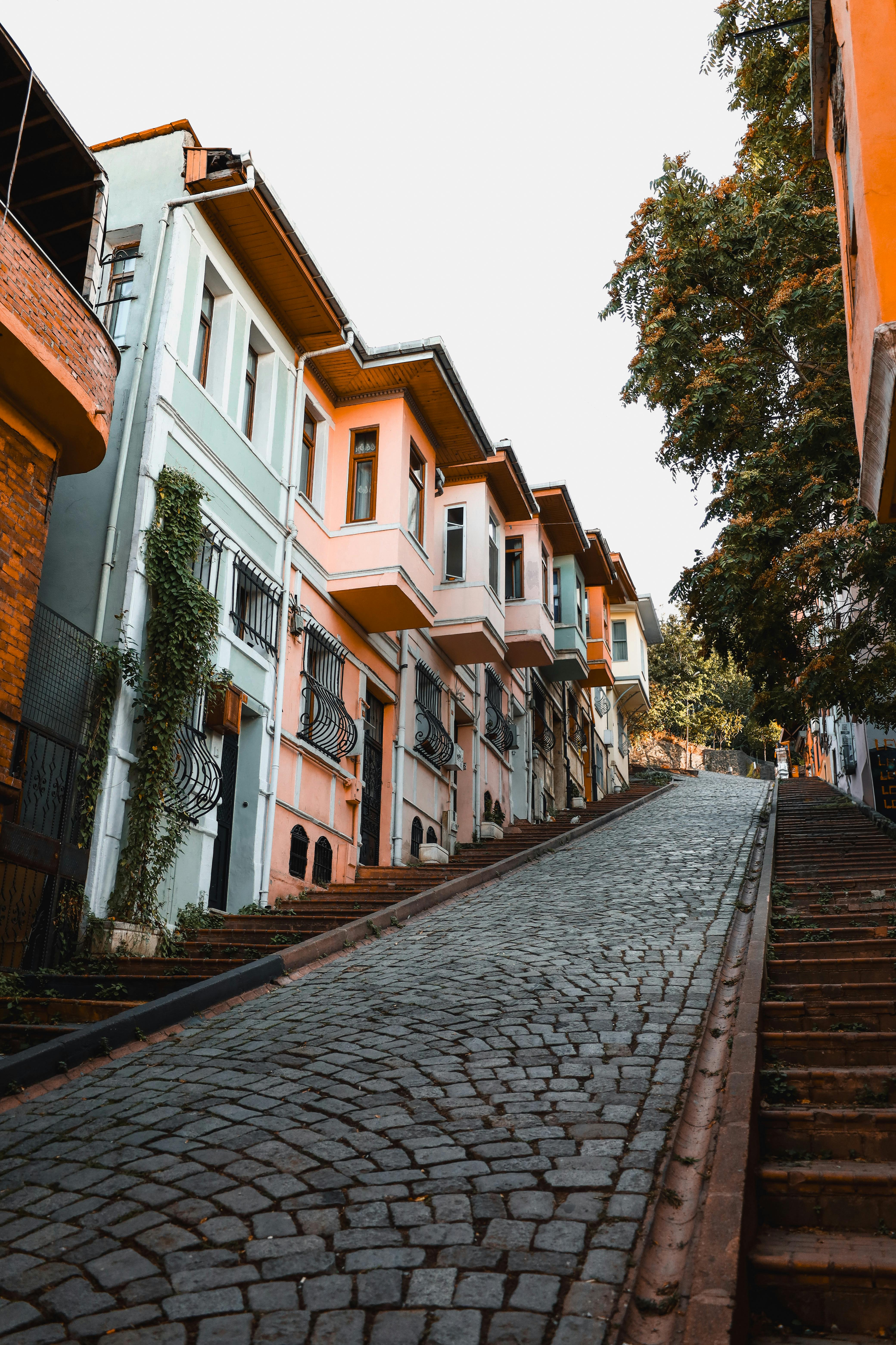 A cobblestone street with colorful buildings · Free Stock Photo