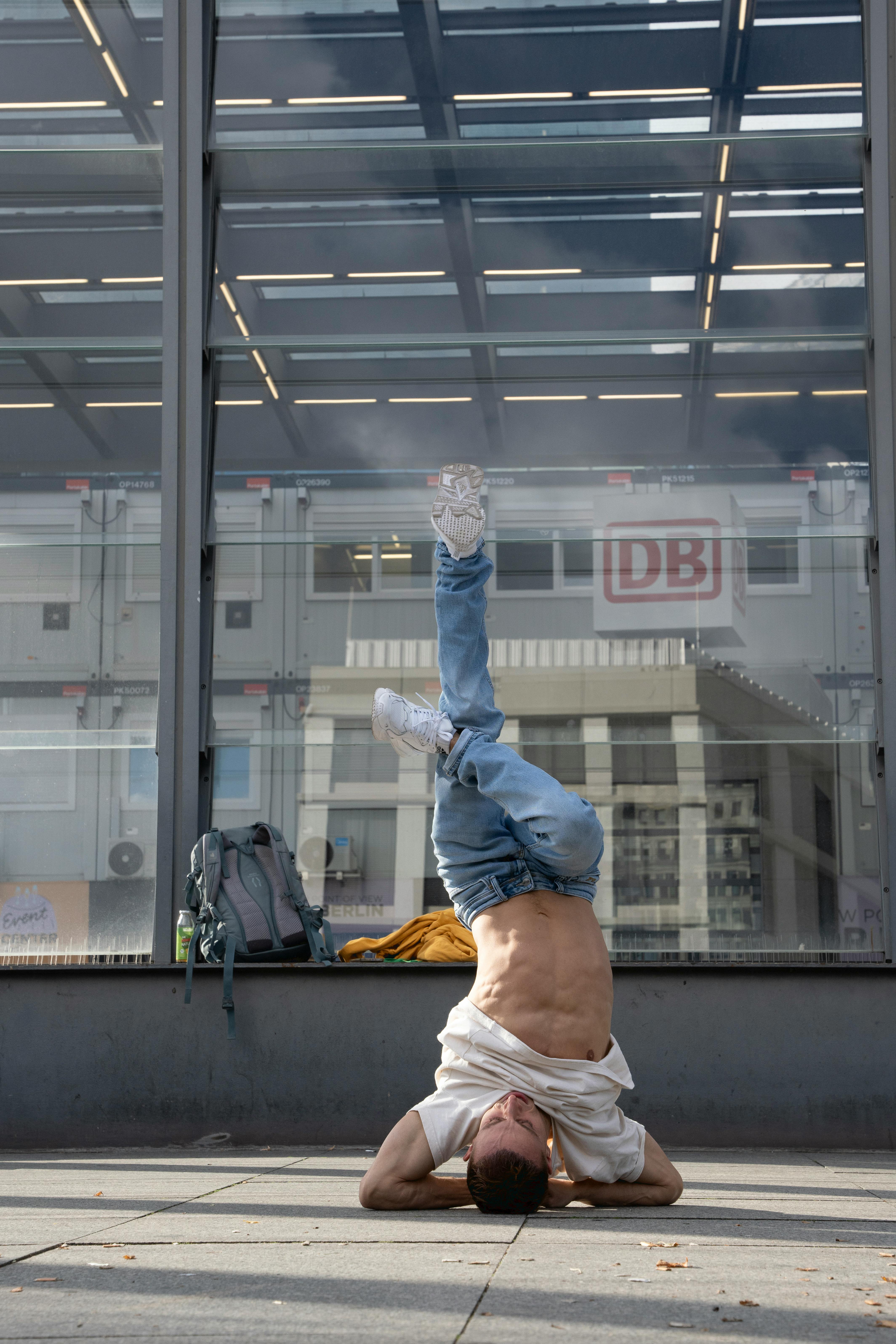 Young man dancing hip hop style on urban landscape · Free Stock Photo