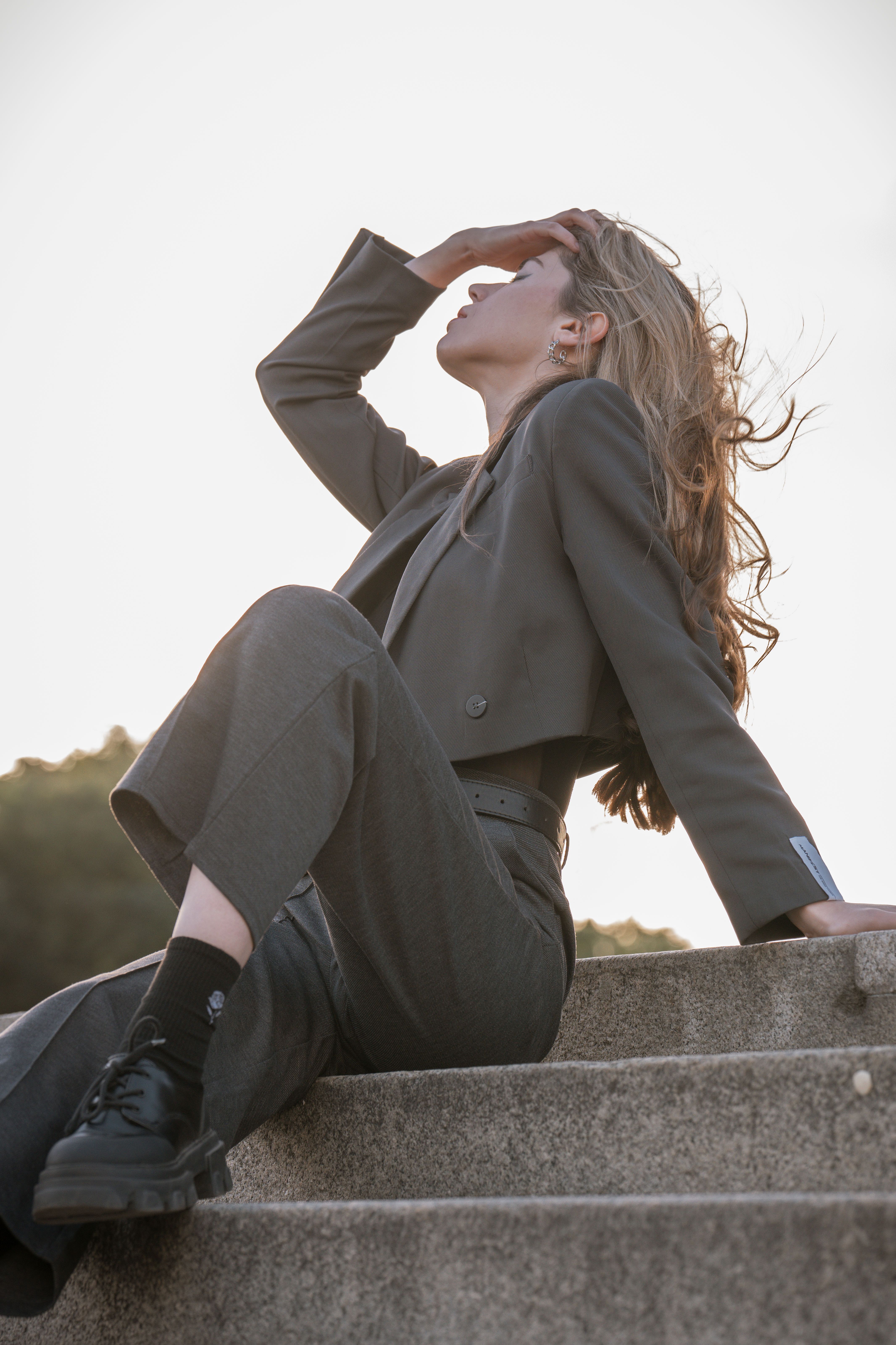 Young Woman Sitting on Steps on Sunset · Free Stock Photo