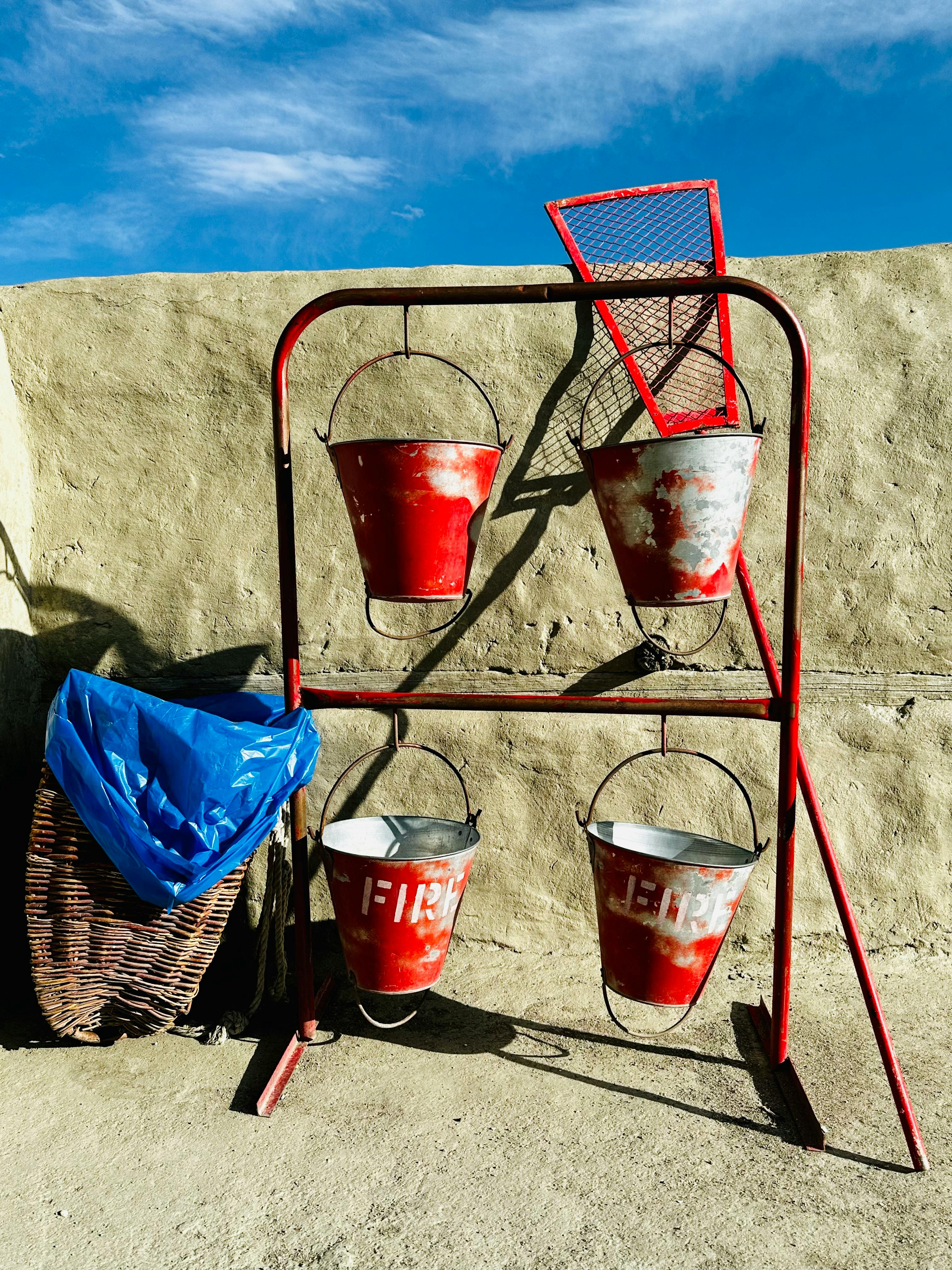 Fire Buckets Hanging on Stand · Free Stock Photo