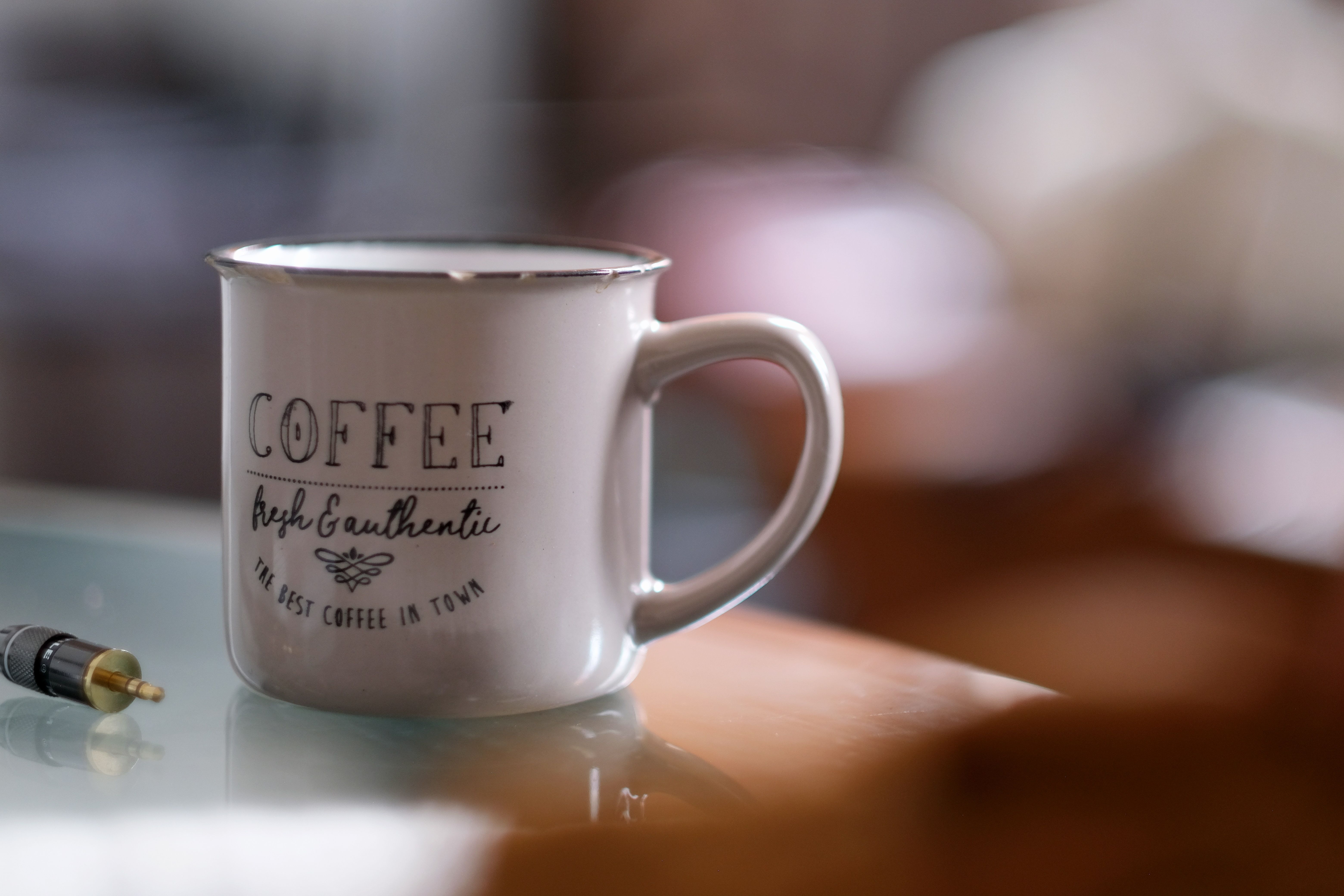 Vintage Ceramic Coffee Mug on Glass Surface · Free Stock Photo