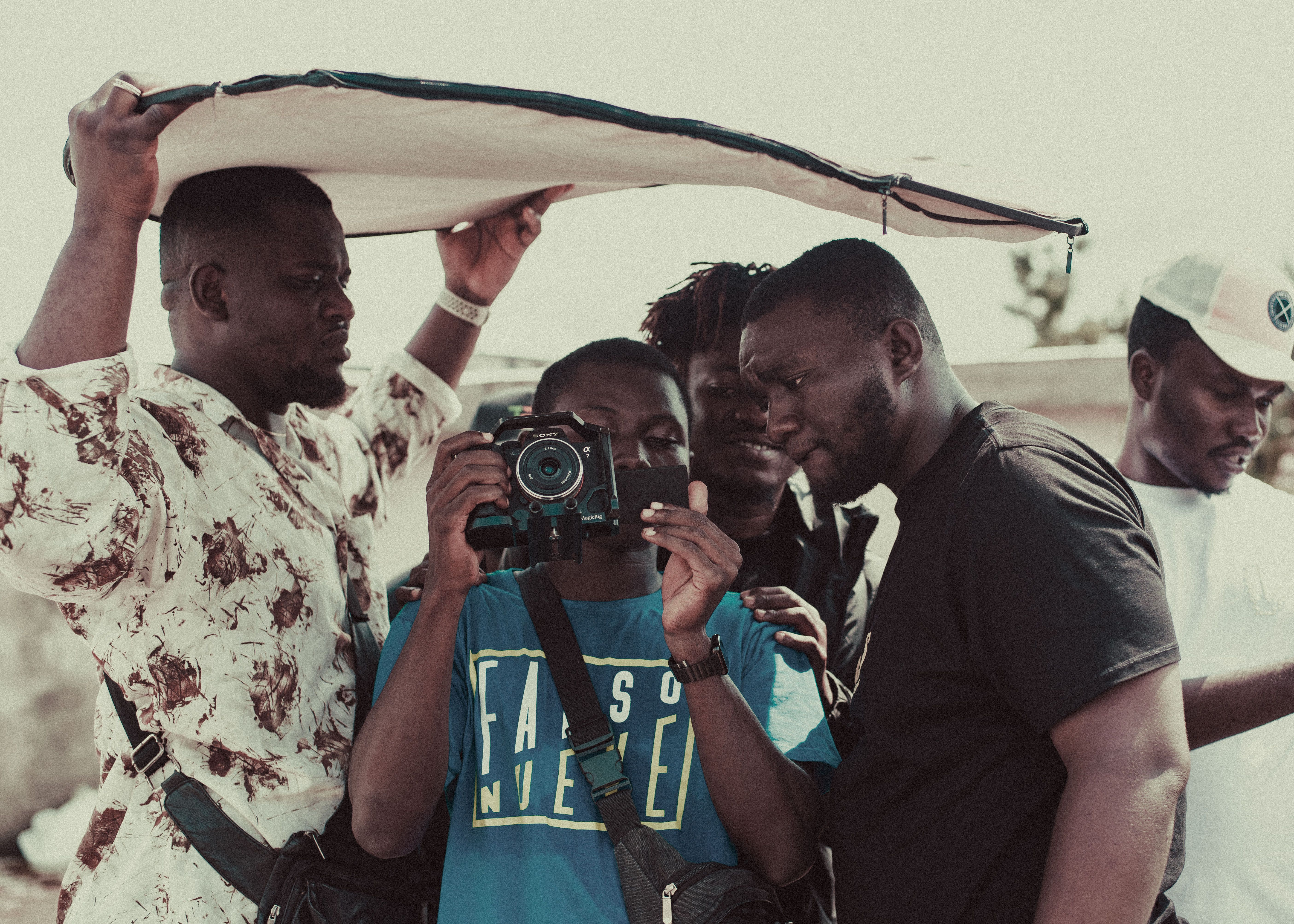 Men Standing with Camera · Free Stock Photo