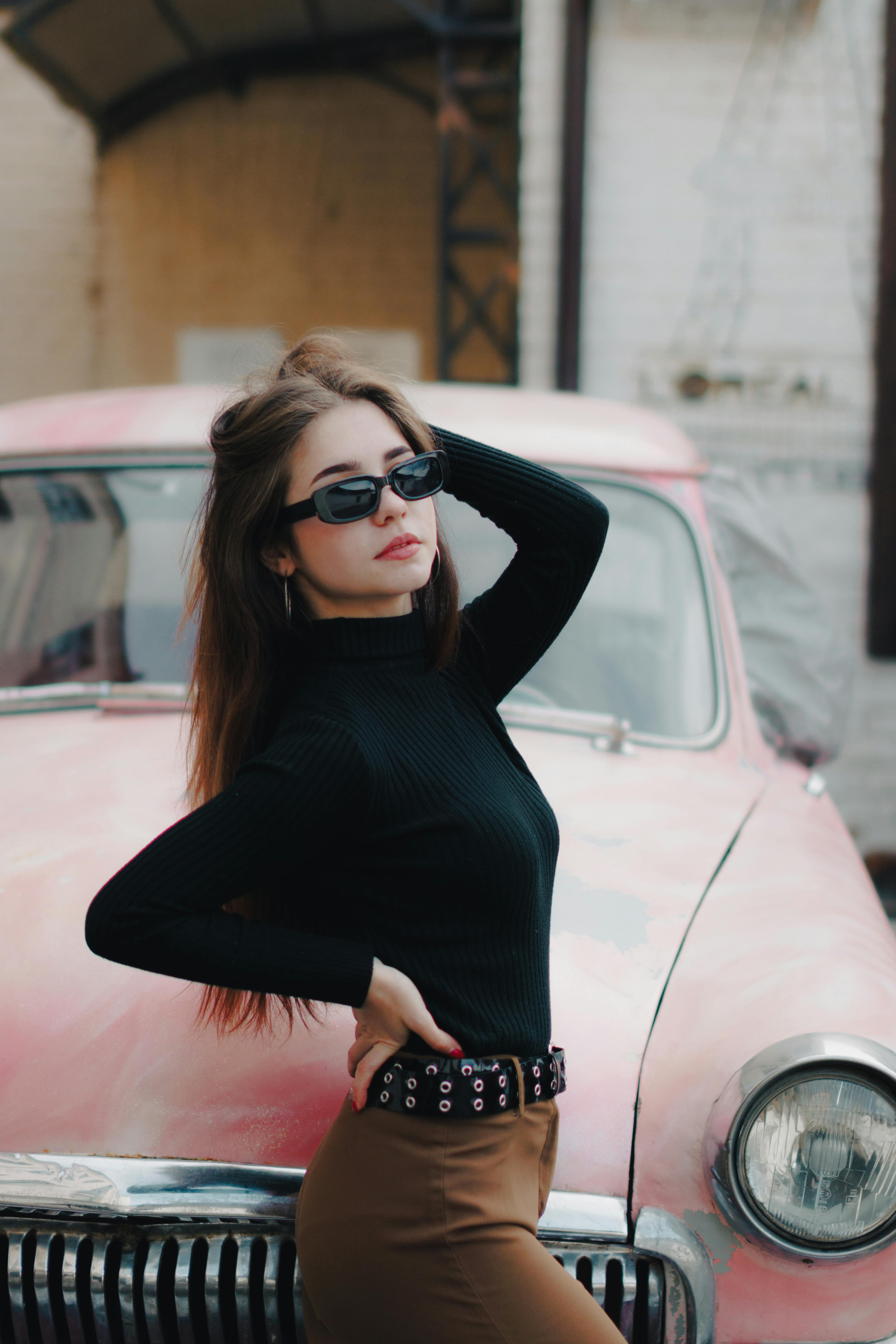 Girl Posing next to a Vintage Car · Free Stock Photo
