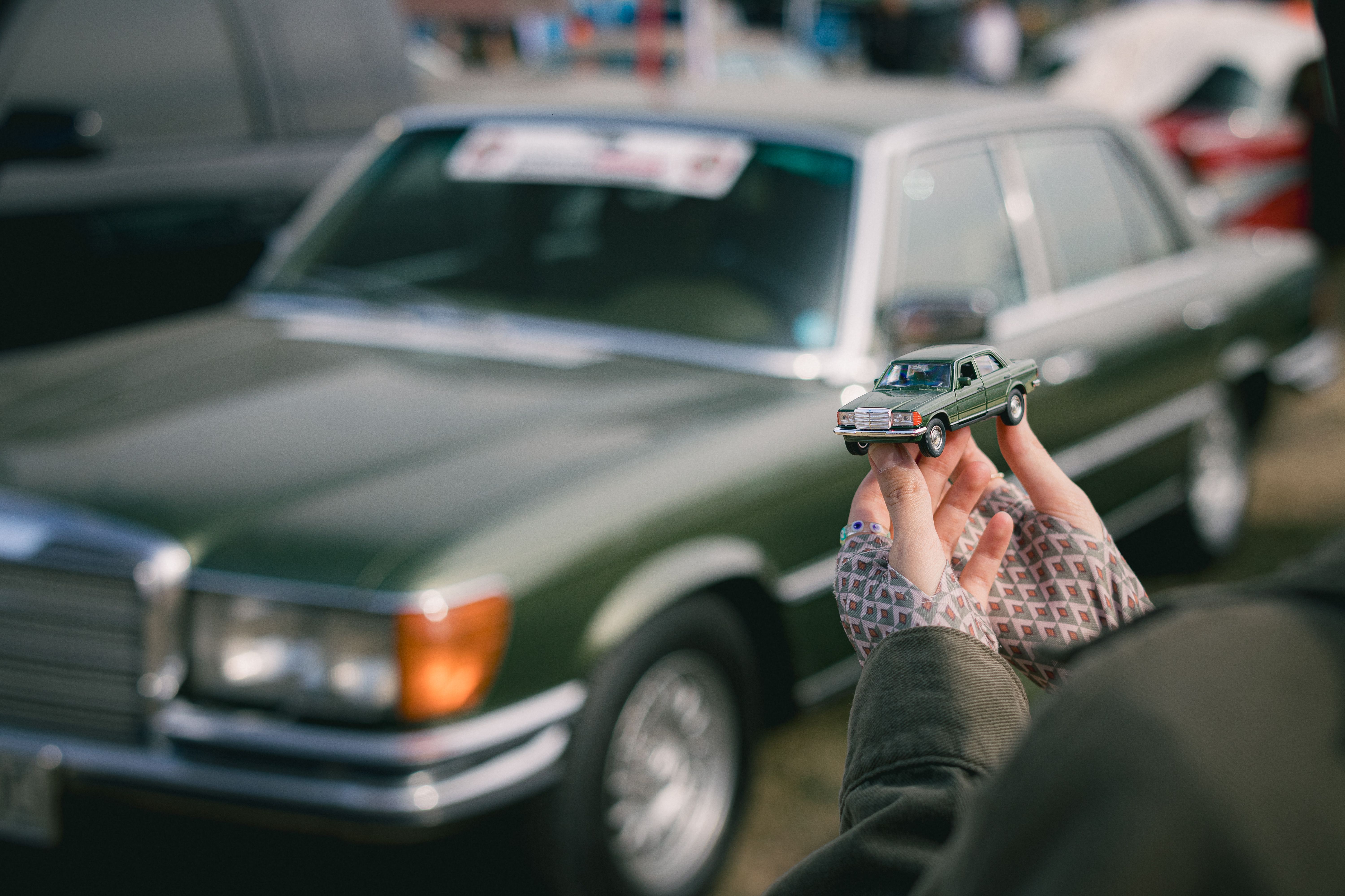 Mercedes W116 Model in Hands of Person Standing in Front of Car · Free ...