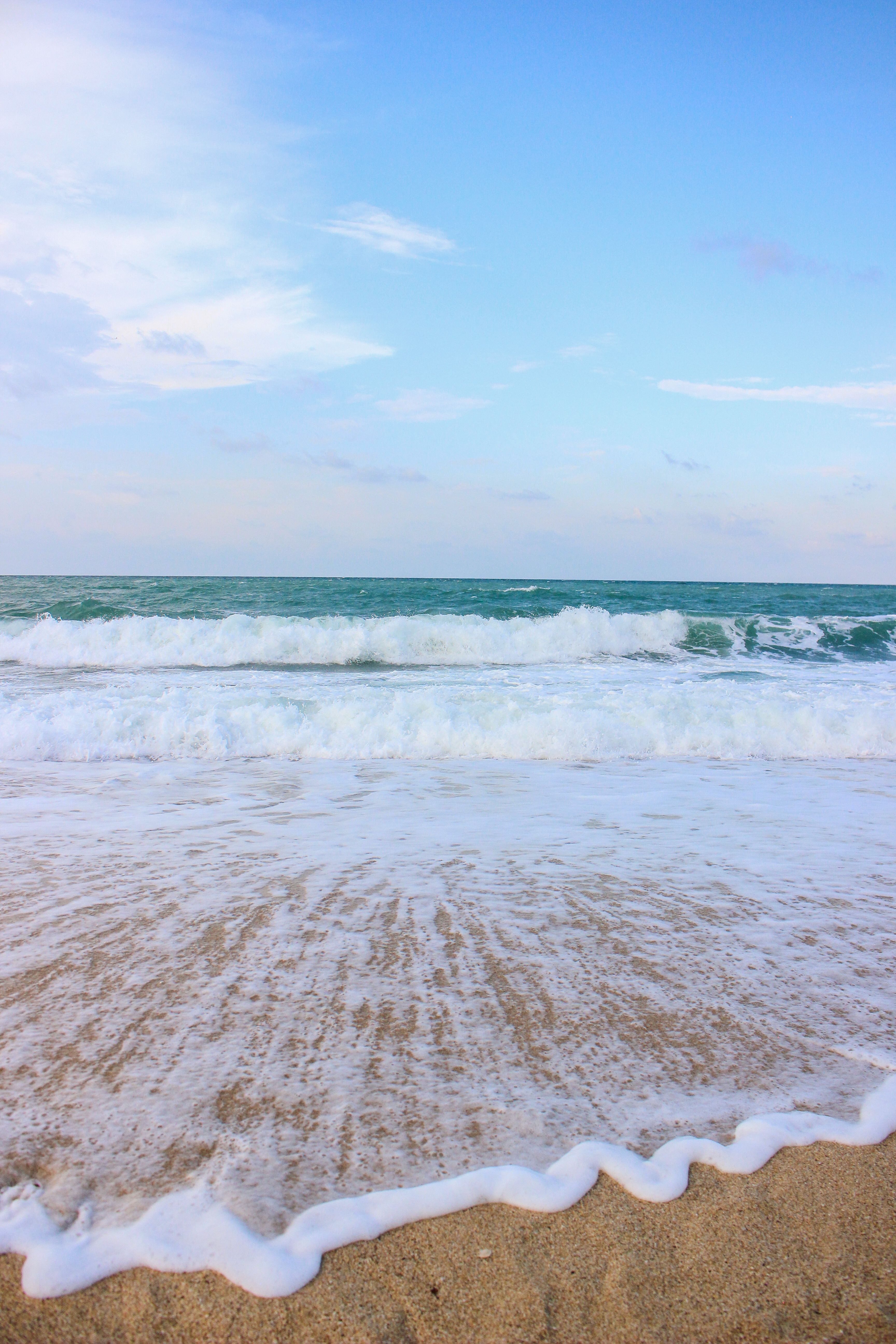 Sea Foam on a Beach · Free Stock Photo