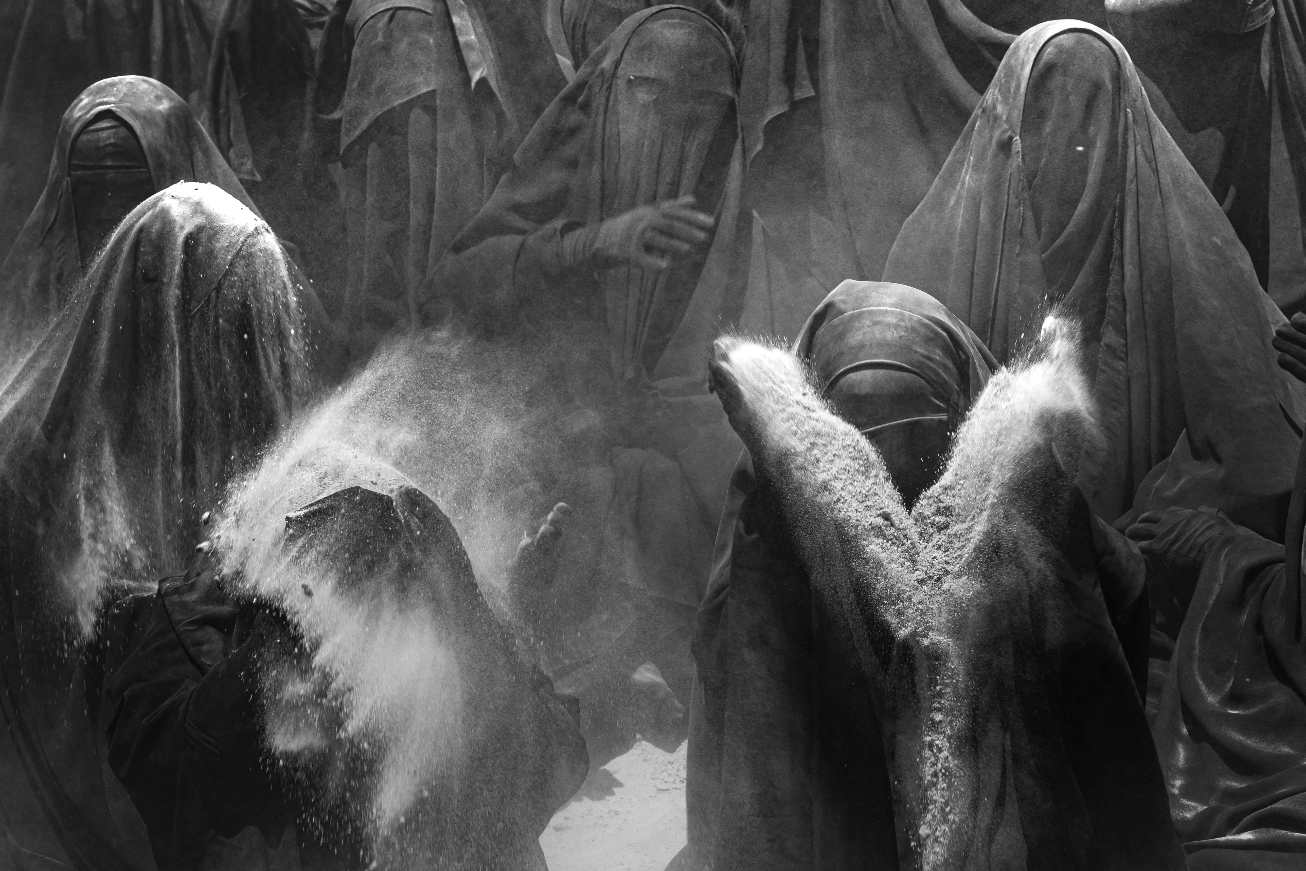 People in Hoods in Ritual Ceremony · Free Stock Photo