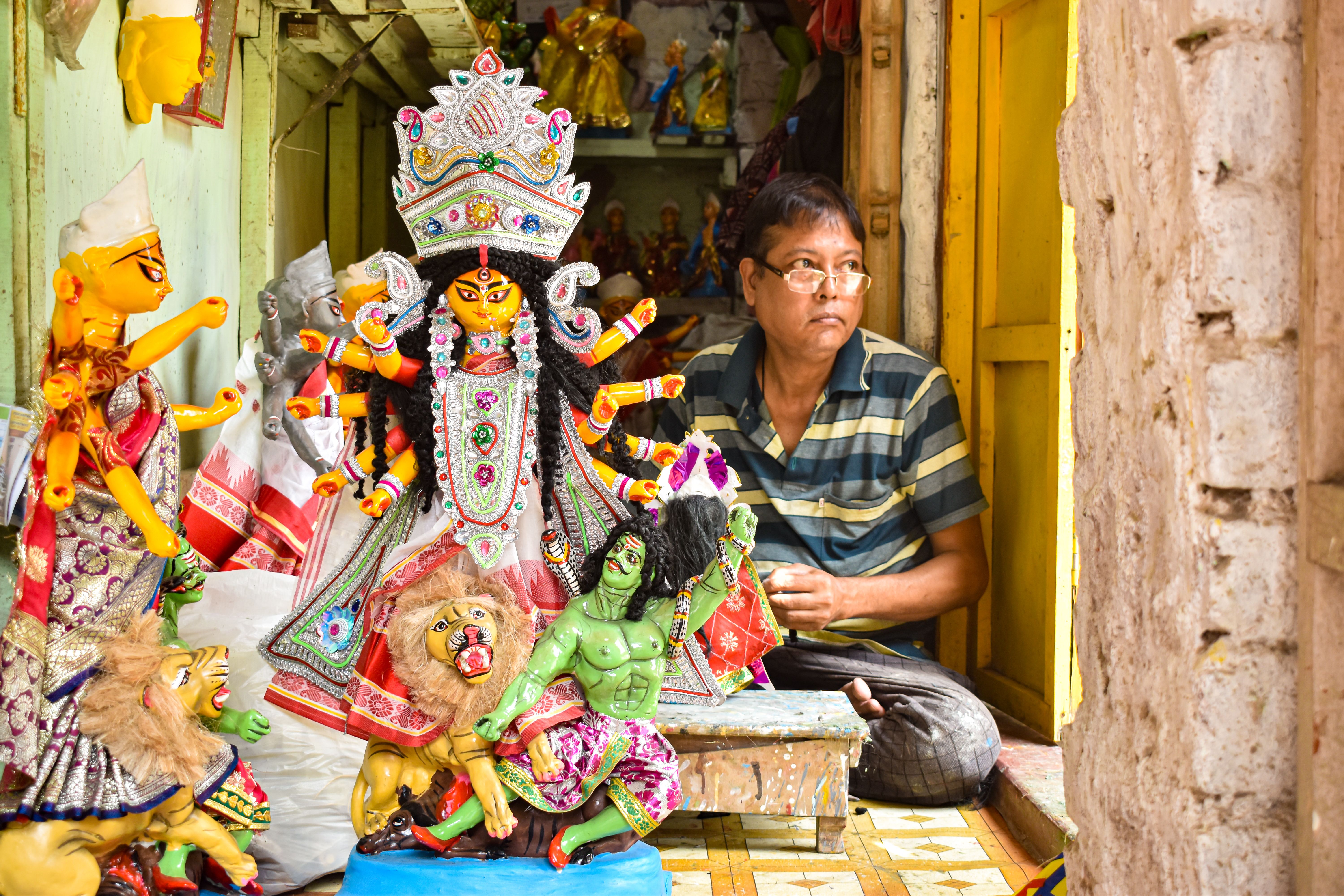Artisan Sitting with Hindu Gods Statues · Free Stock Photo