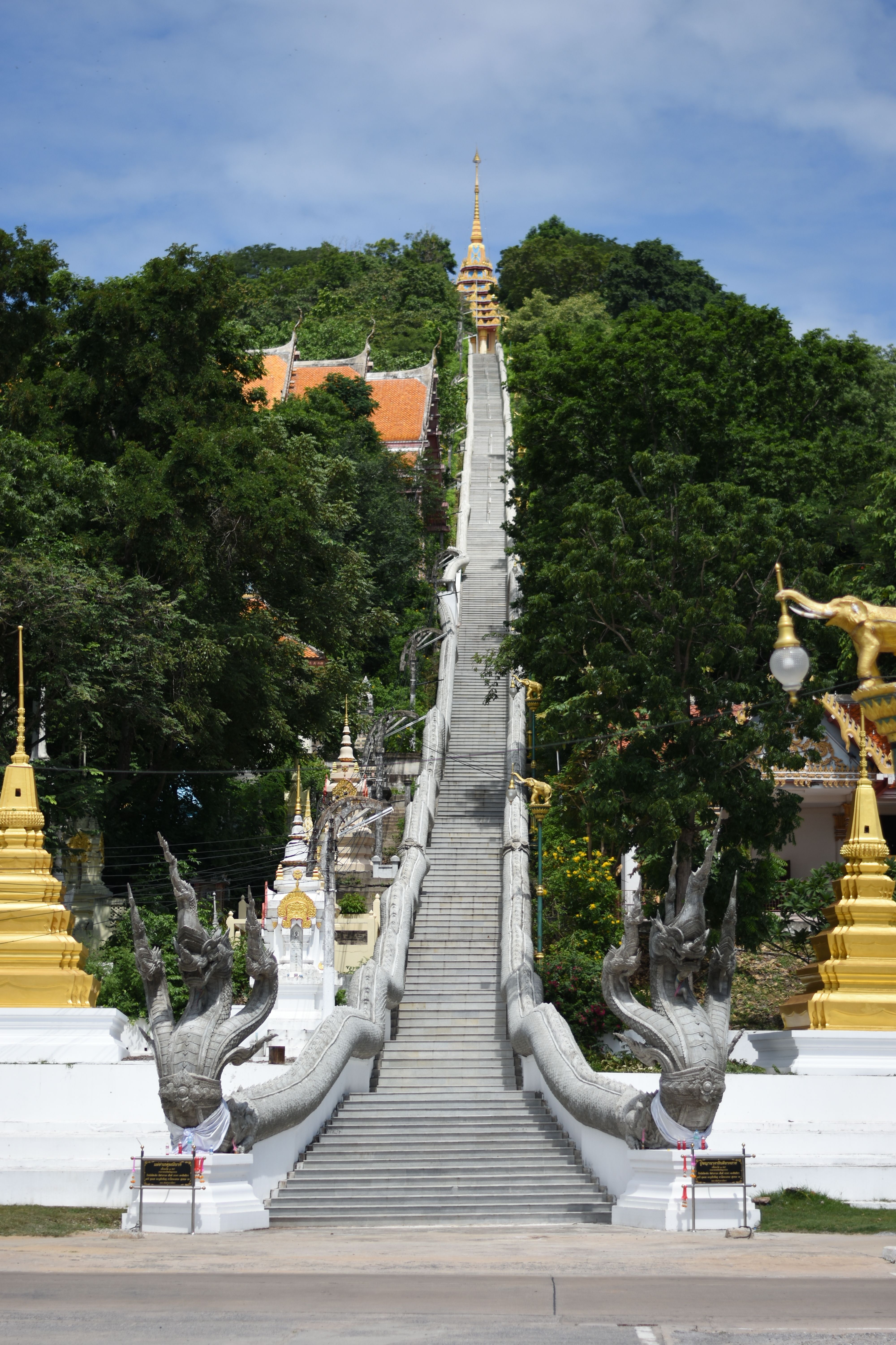 Man Walking near Ornamented Statues by Stairs · Free Stock Photo