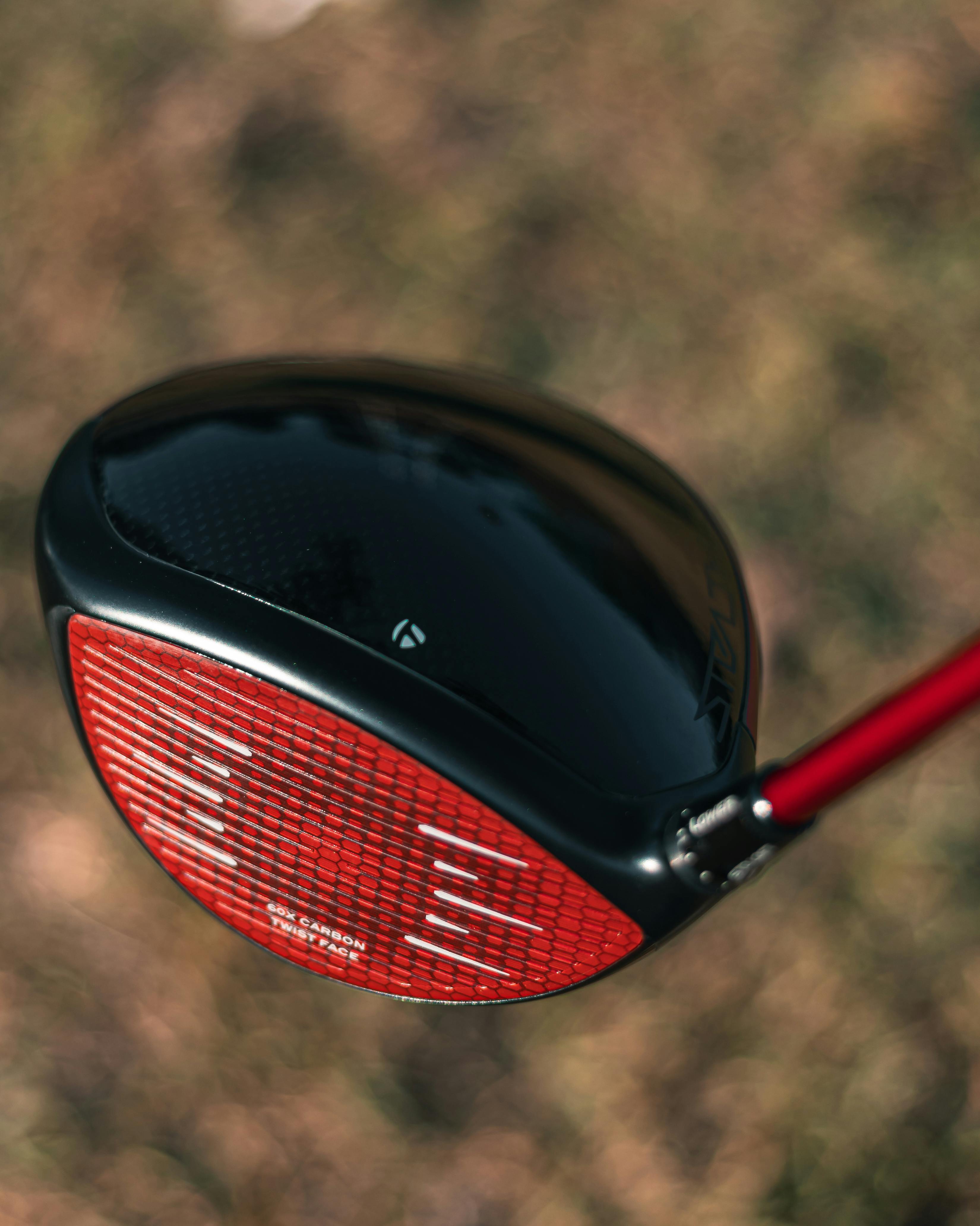 Head of a Red and Black Golf Club · Free Stock Photo