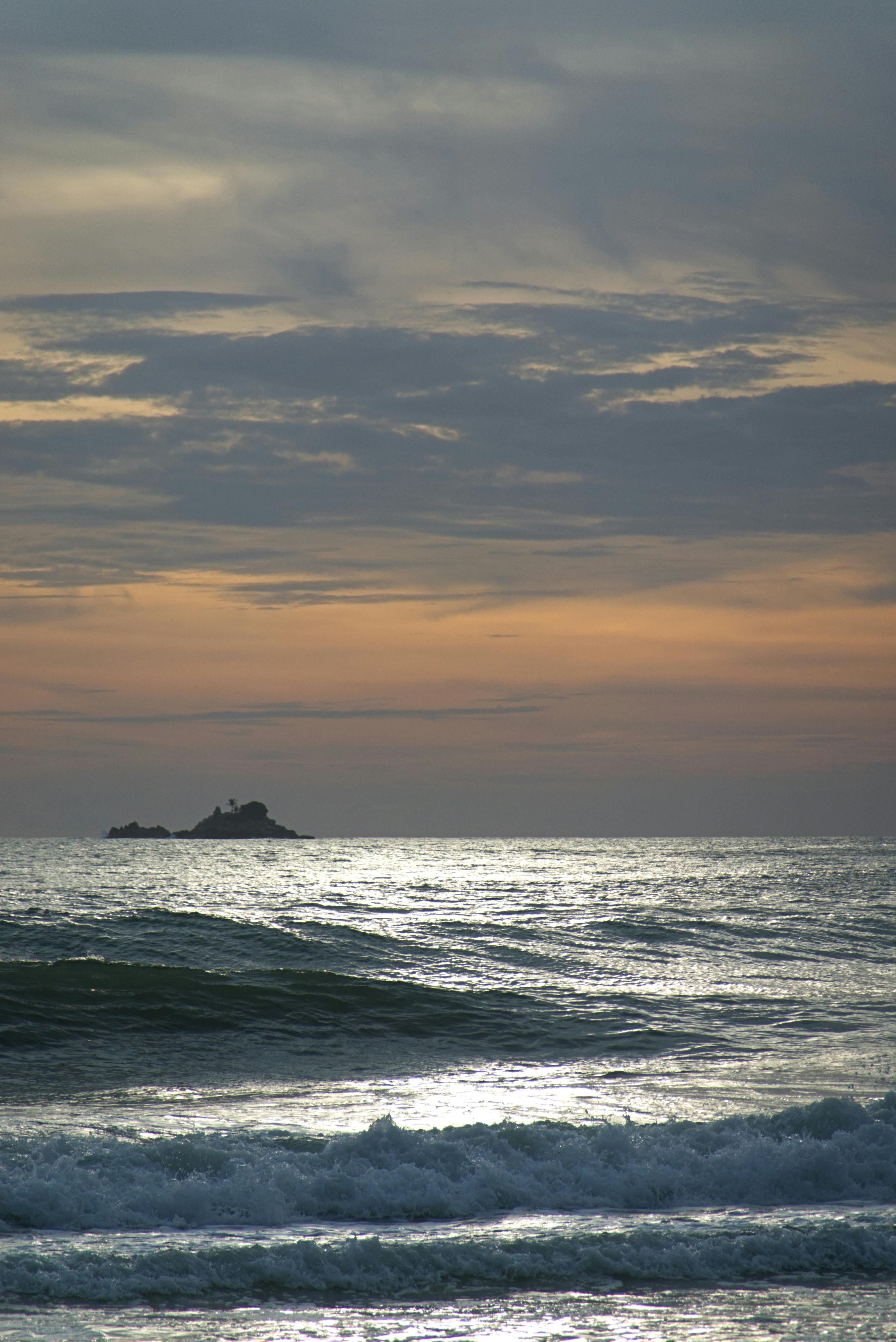 Cloudy Sky over Ocean Shore · Free Stock Photo
