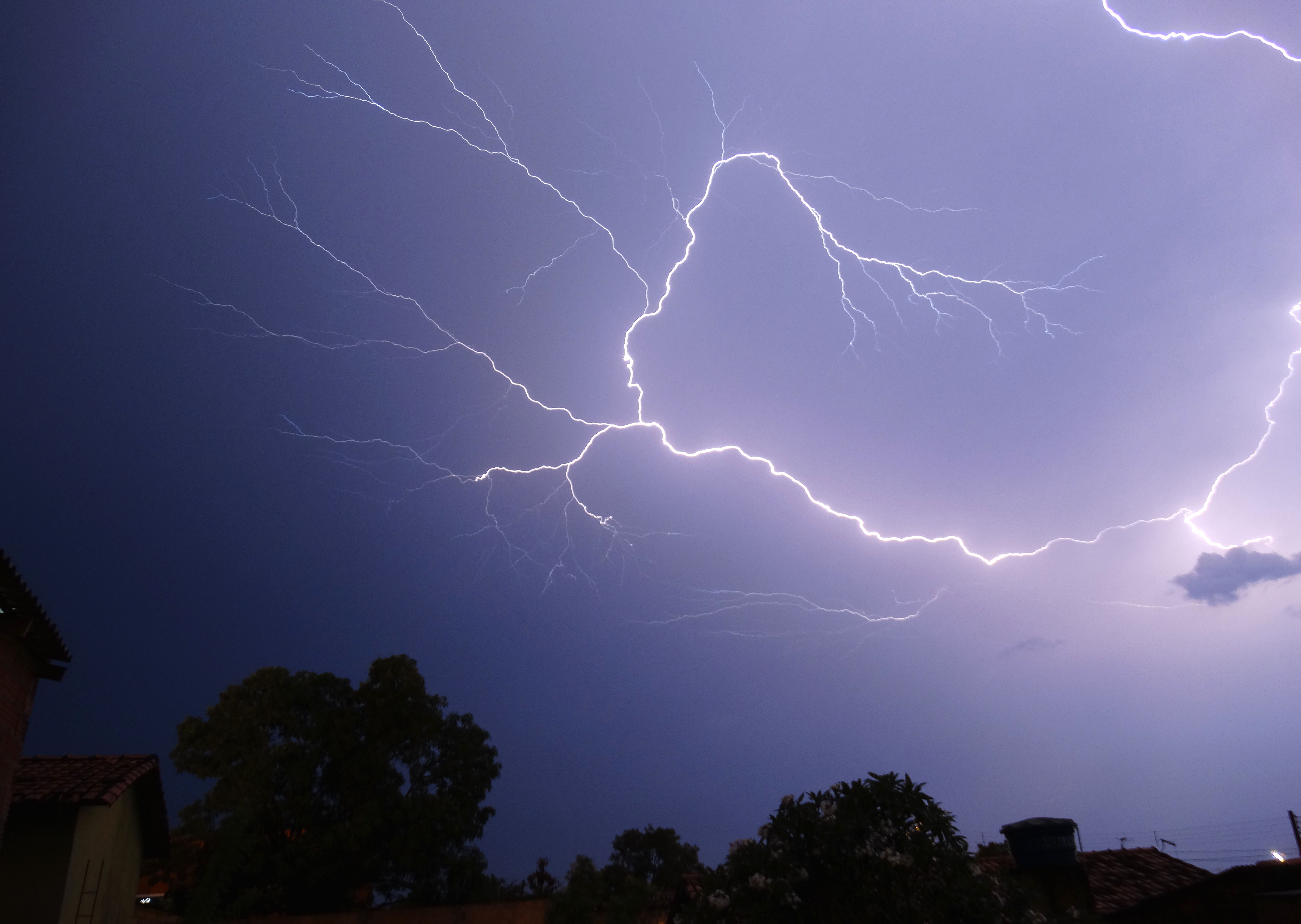 Brown Concrete House Under Lightning · Free Stock Photo