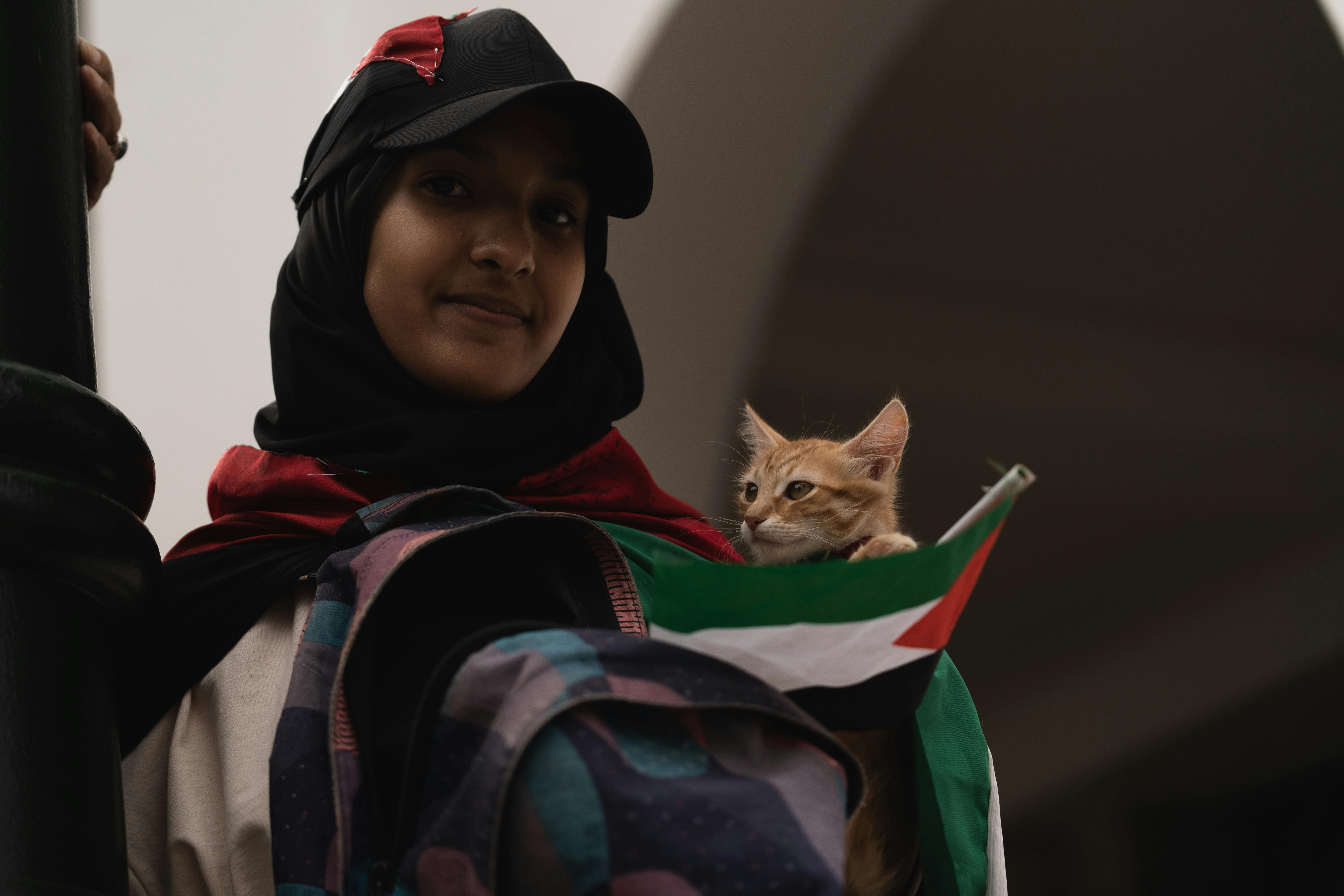 Woman Holding a Cat and Lebanese Flag · Free Stock Photo