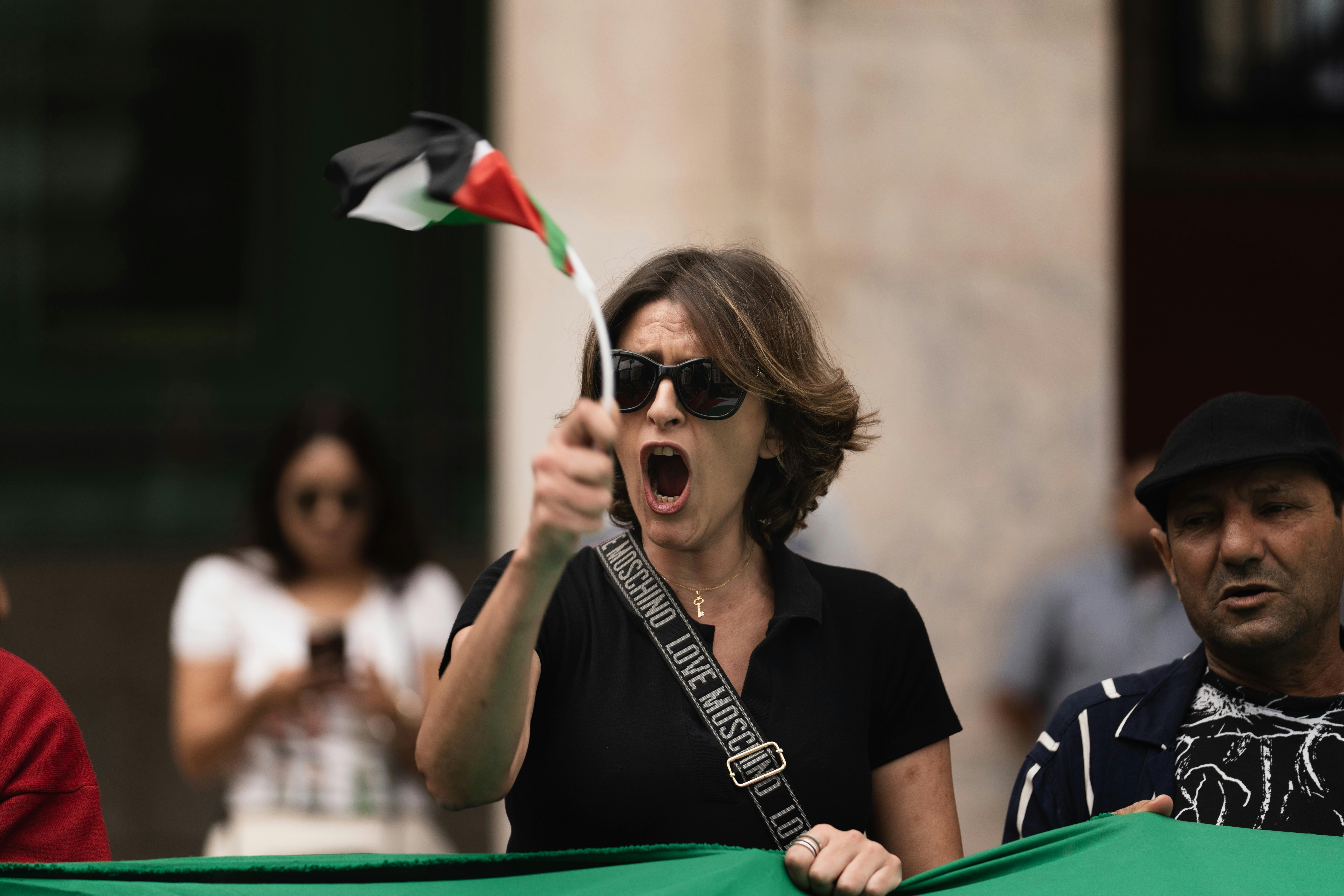 Woman Waving a Flag · Free Stock Photo