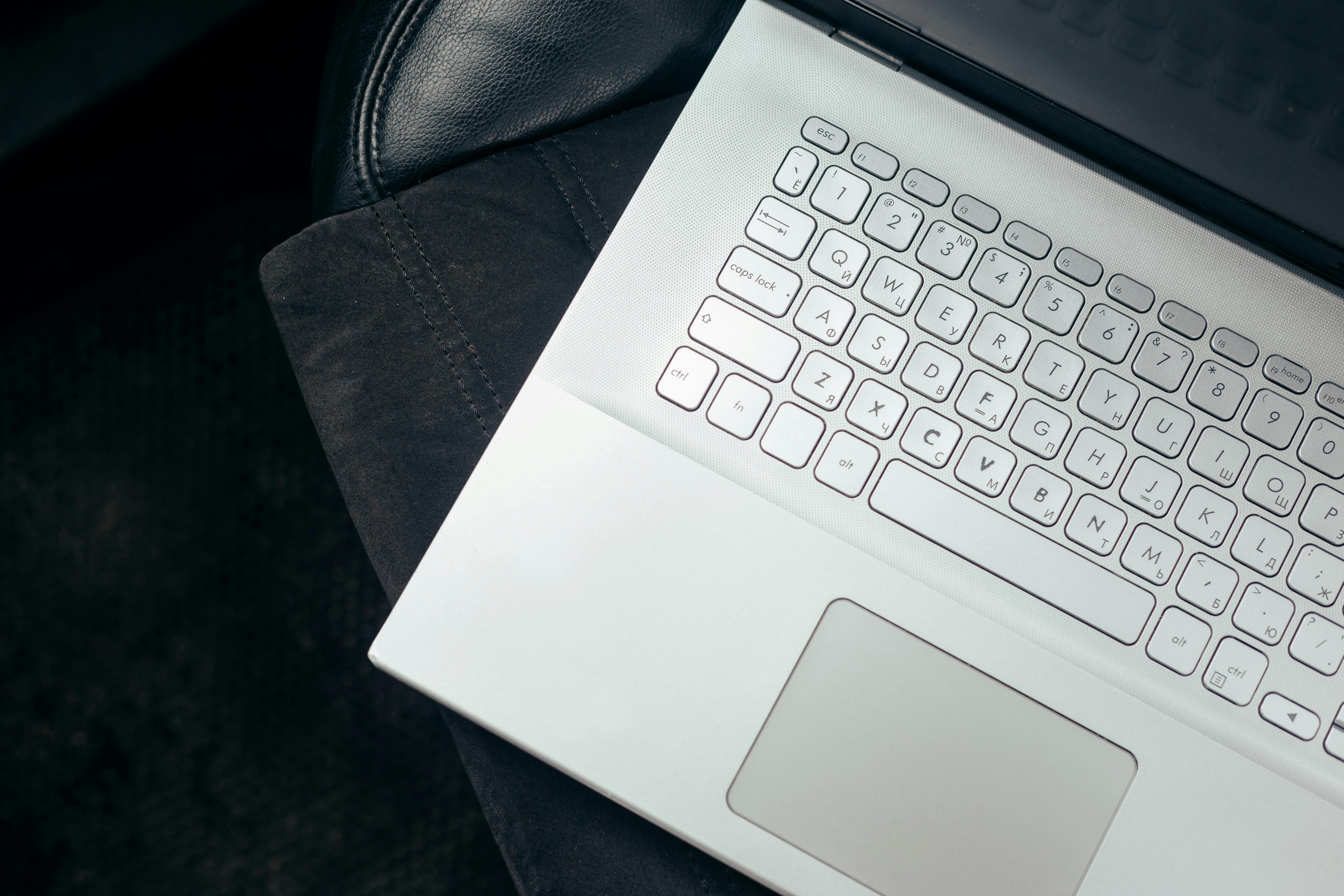 Laptop Keyboard and Touchpad on Car Seat · Free Stock Photo
