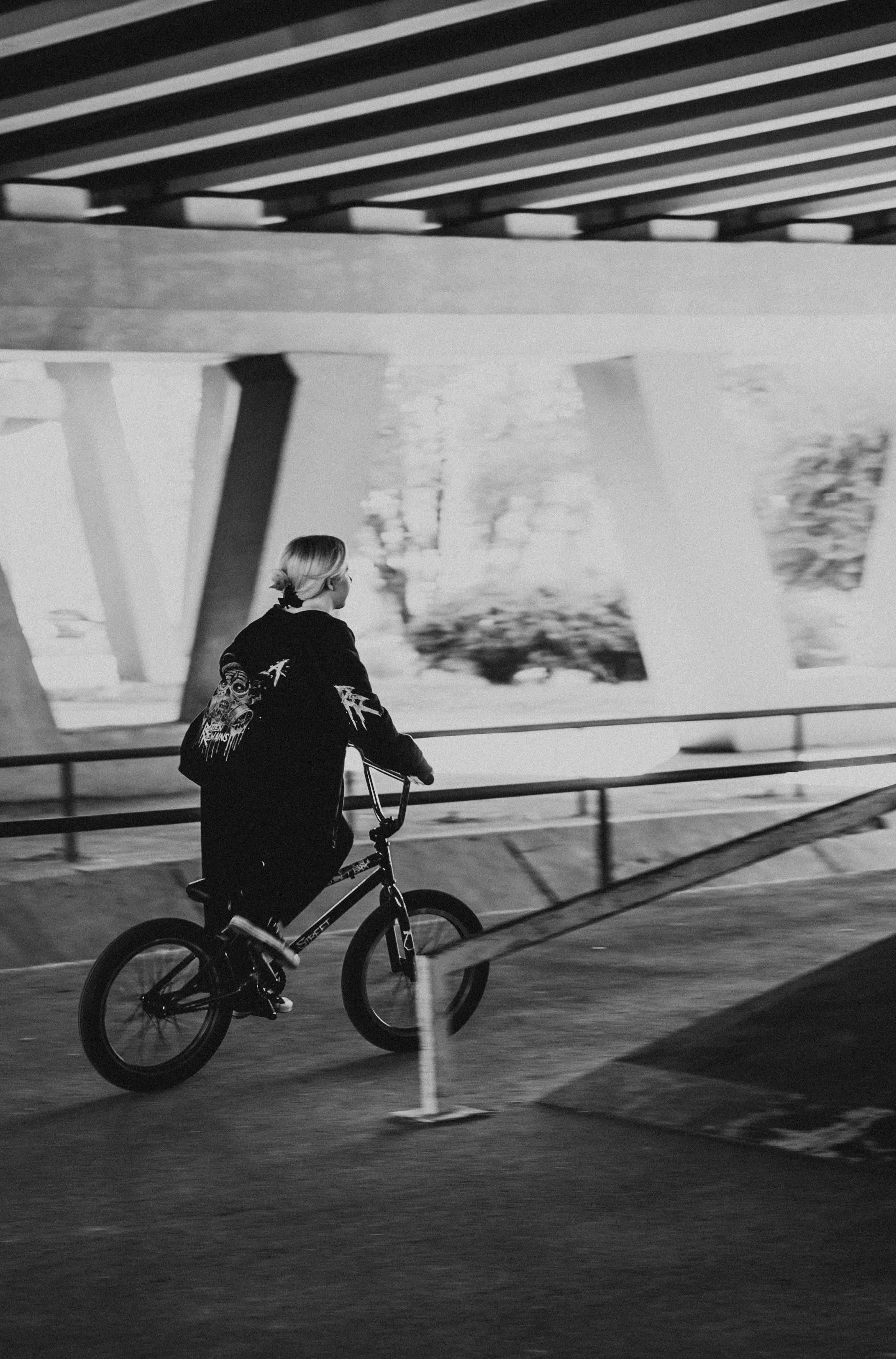 Woman Riding Bike in Black and White · Free Stock Photo