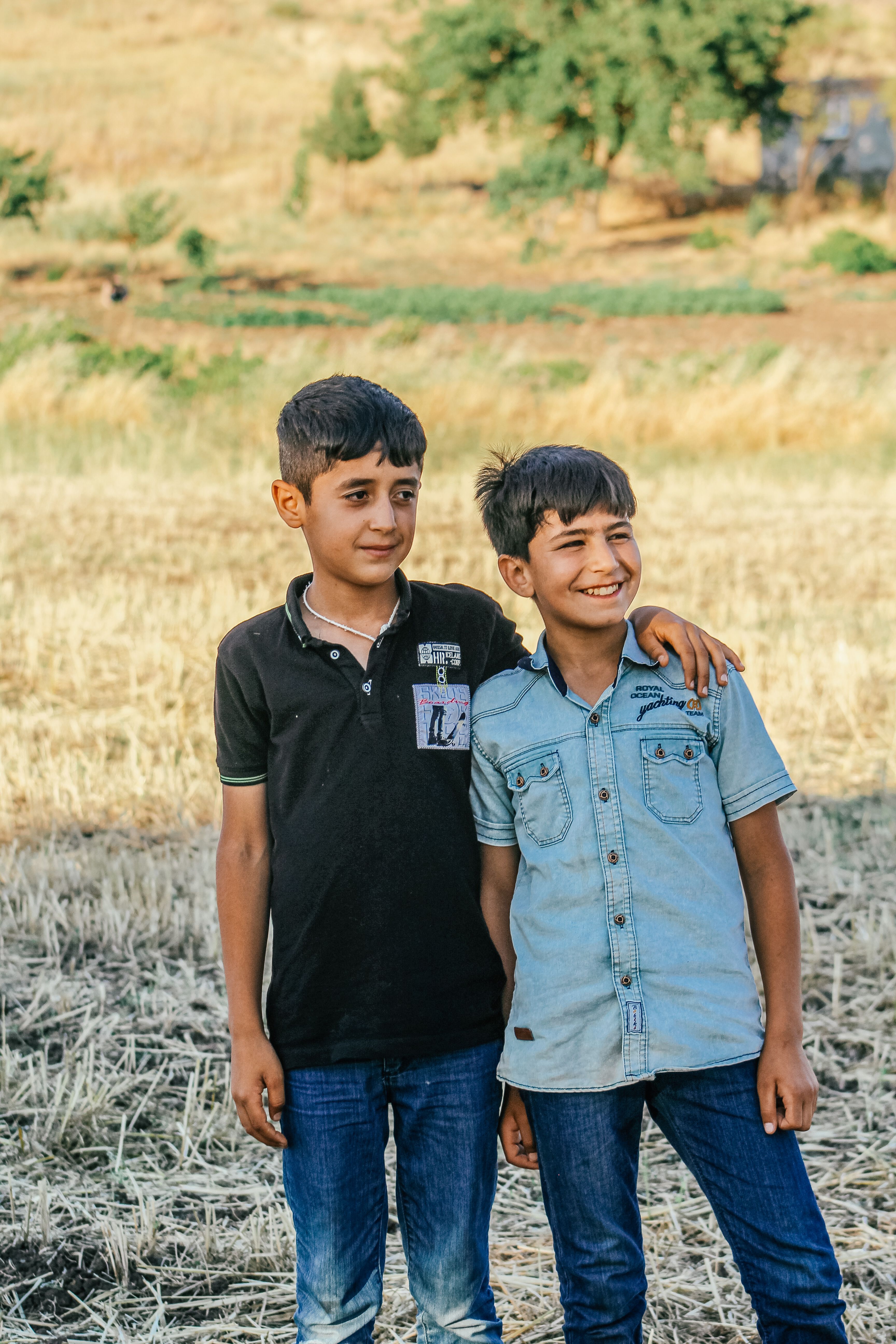 Smiling Boys Standing Together · Free Stock Photo