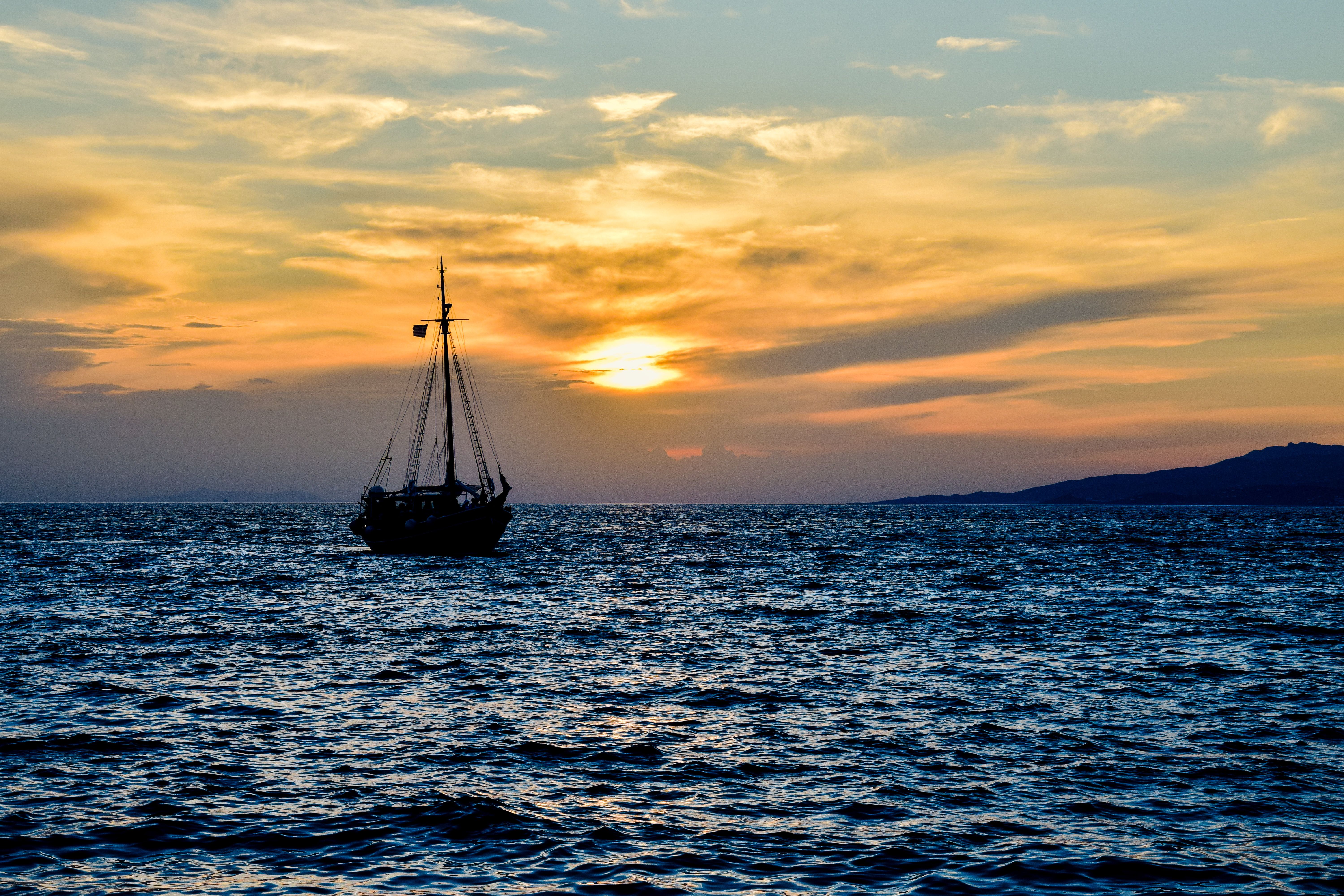 Ship Sailing on Sea at Sunset · Free Stock Photo