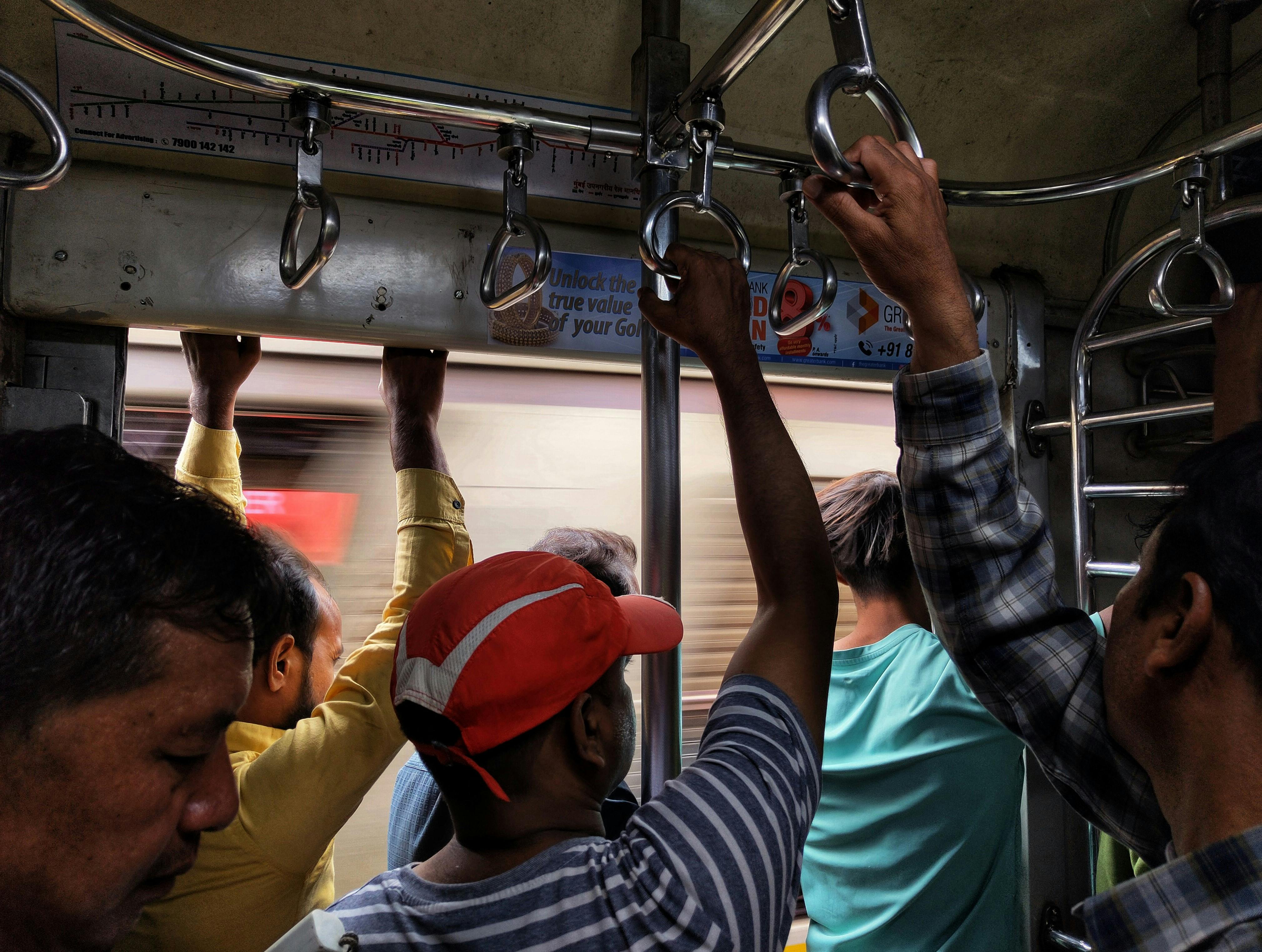 People on Crowded Metro Train · Free Stock Photo