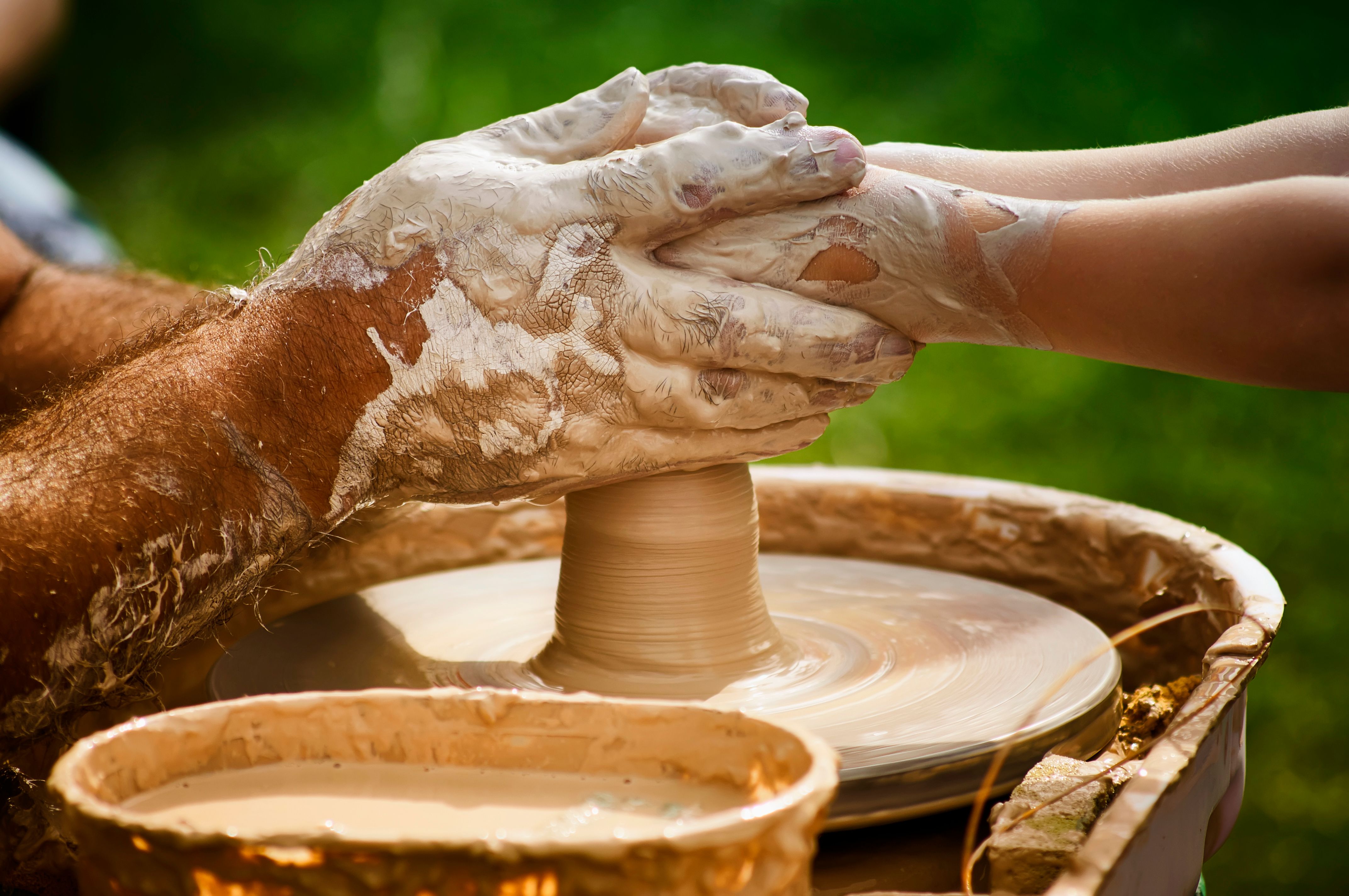 Man and Child making a Clay Pot · Free Stock Photo