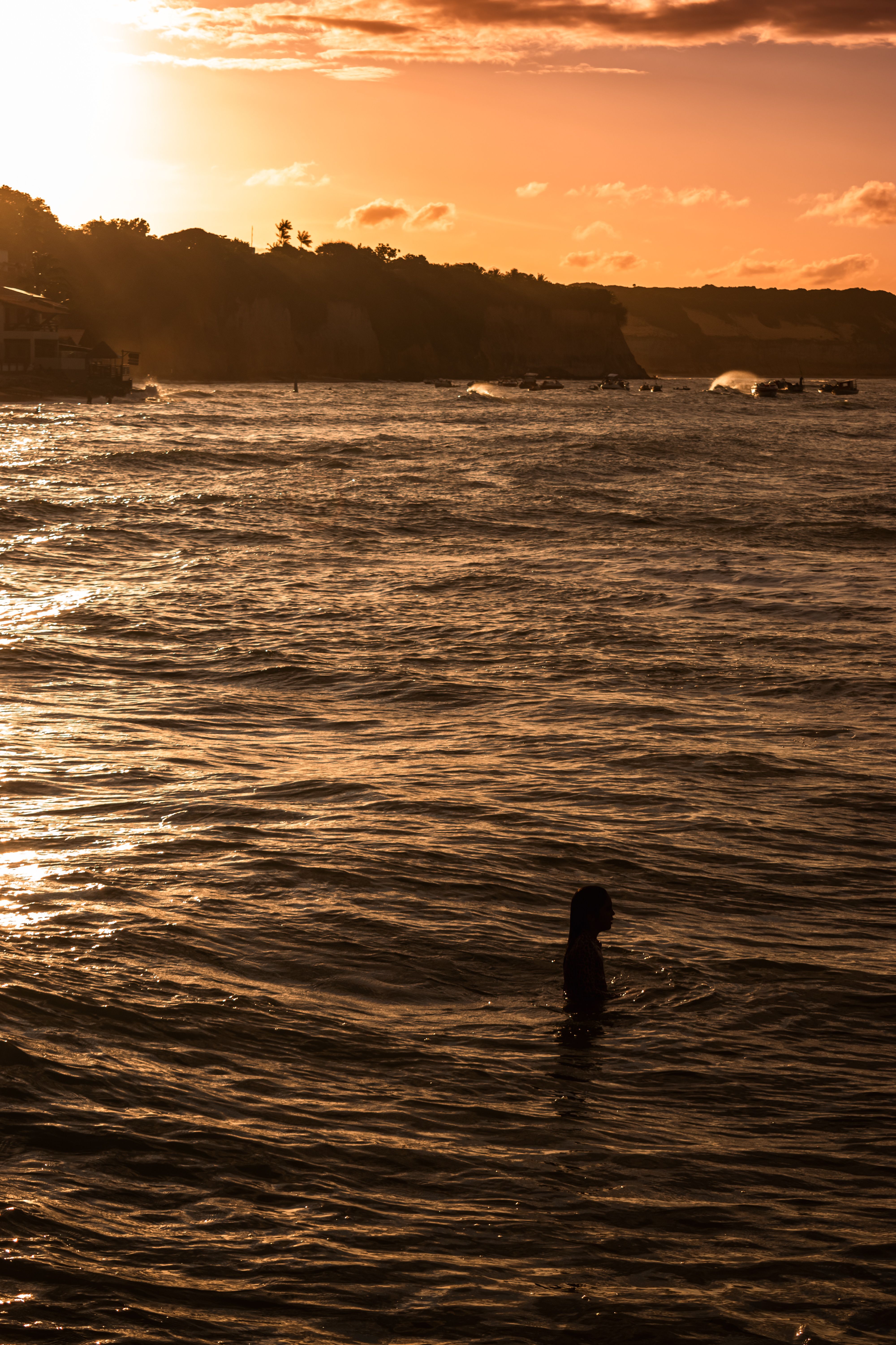 Person Swimming in the Sea at Sunset · Free Stock Photo