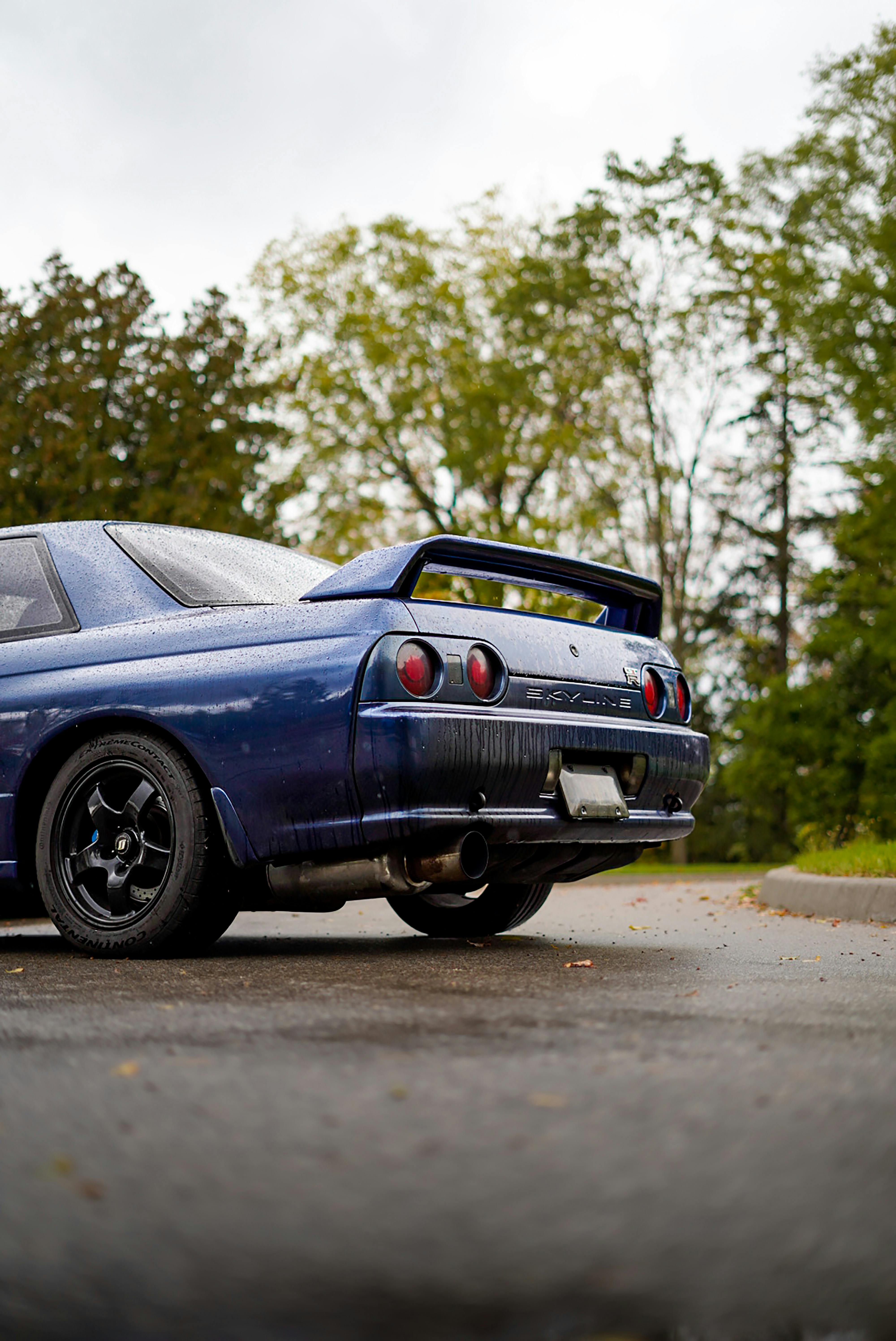 Rear View or a Blue Nissan Skyline Car · Free Stock Photo