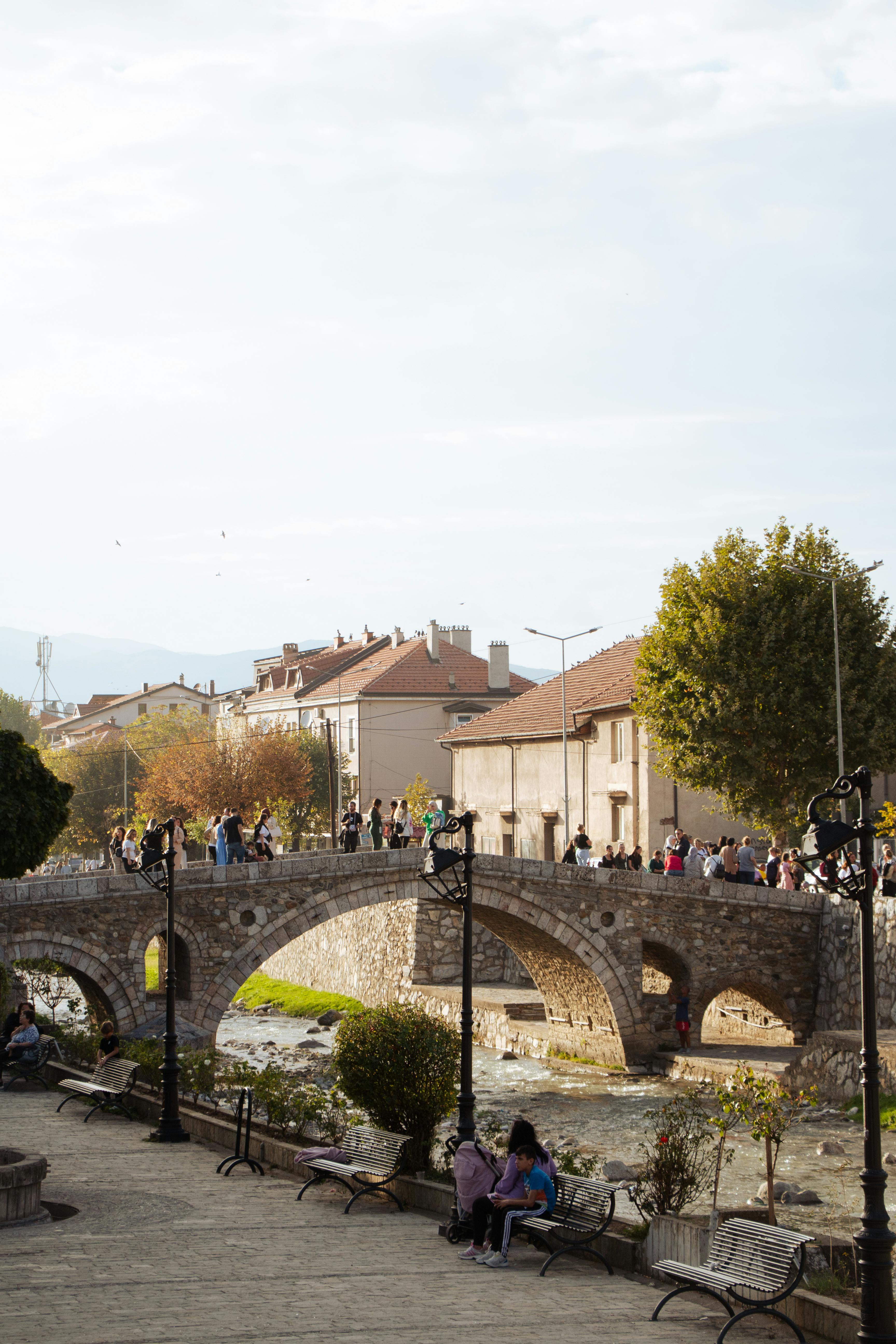Aerial Photography of People Crossing Bridge over Body of Water · Free ...