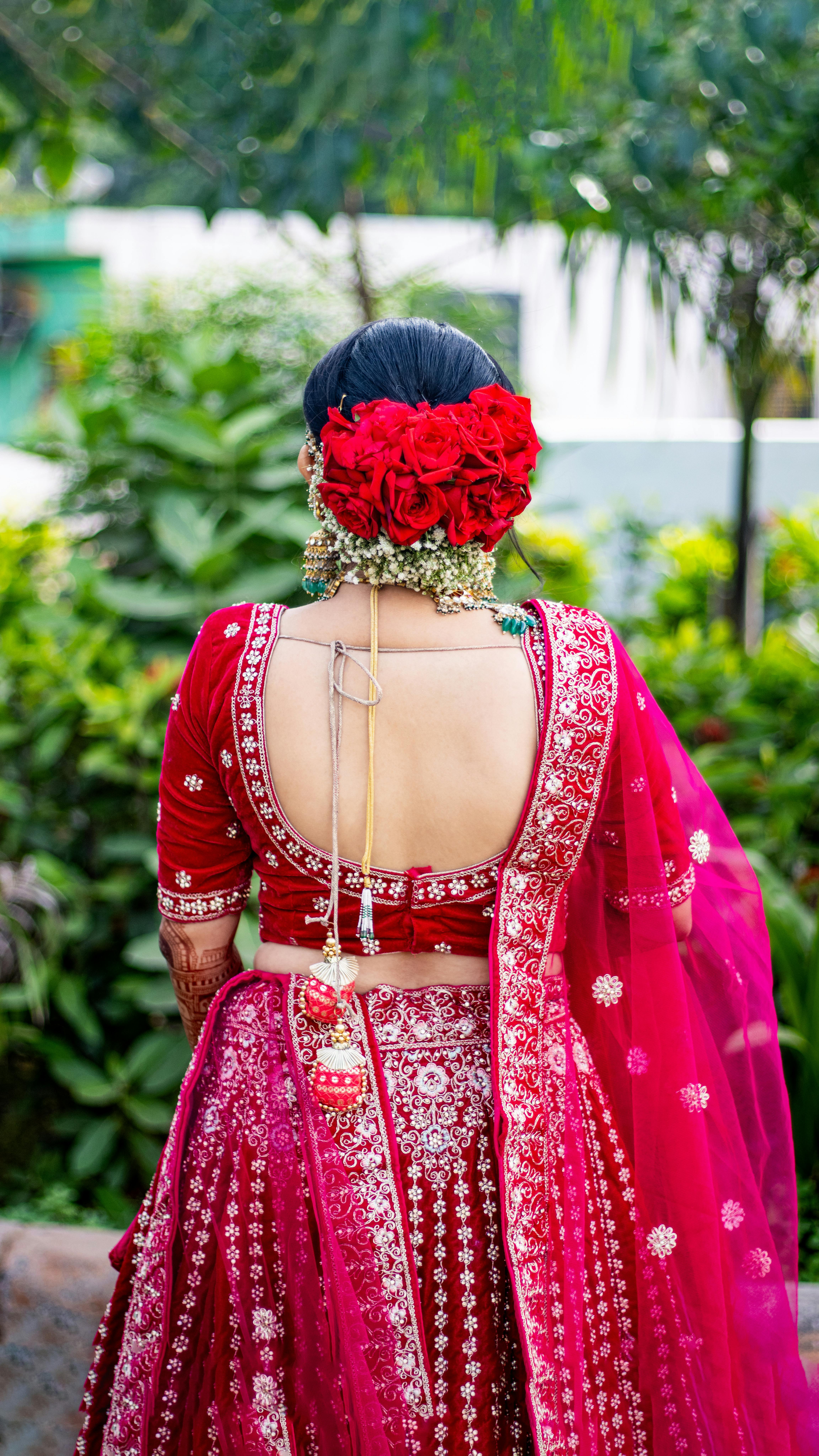 Laughing Bride in a Red Saree Among Falling Golden Petals · Free Stock ...