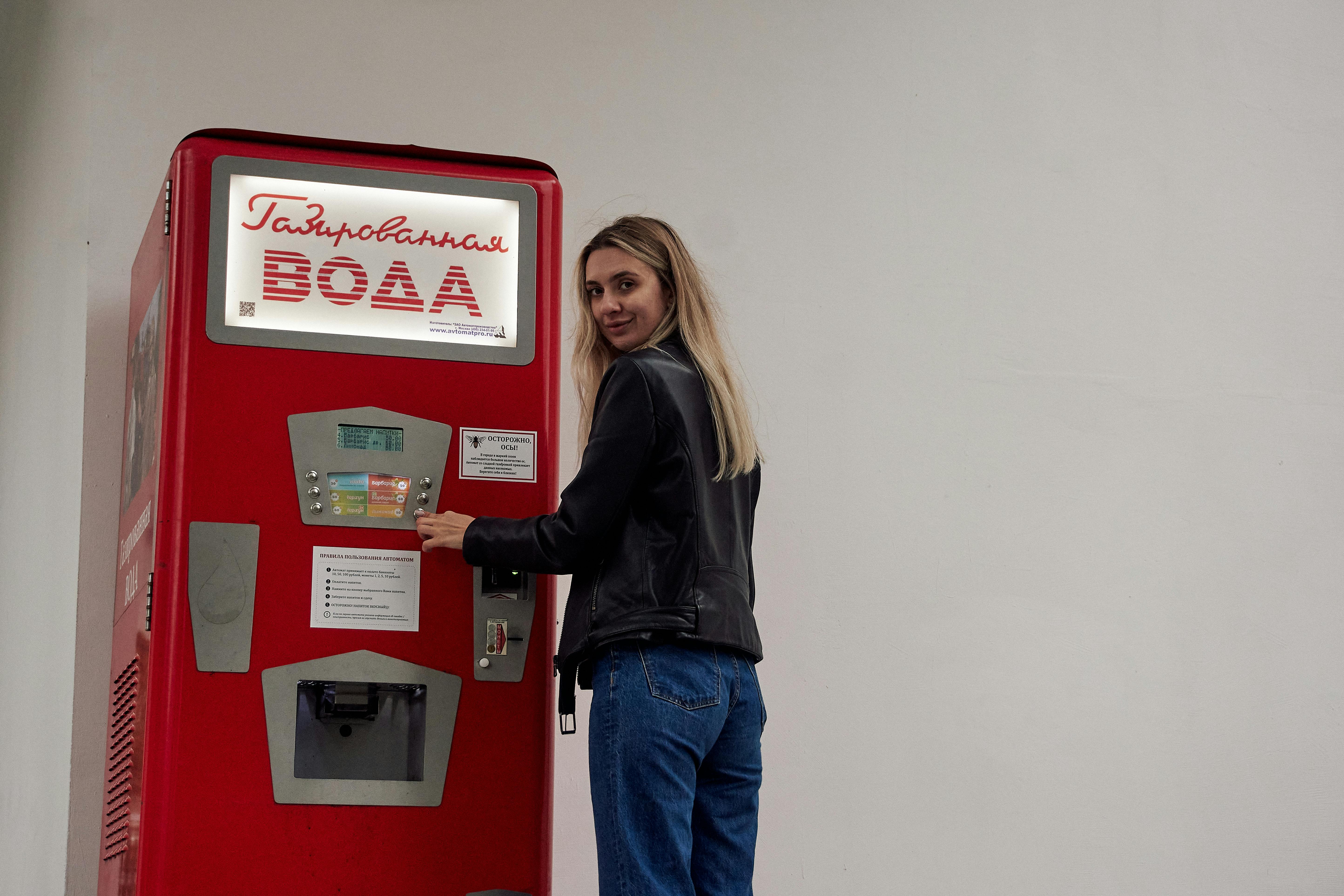 Woman Wearing Blue Chambray Jacket Drinking Soda with a Straw · Free ...