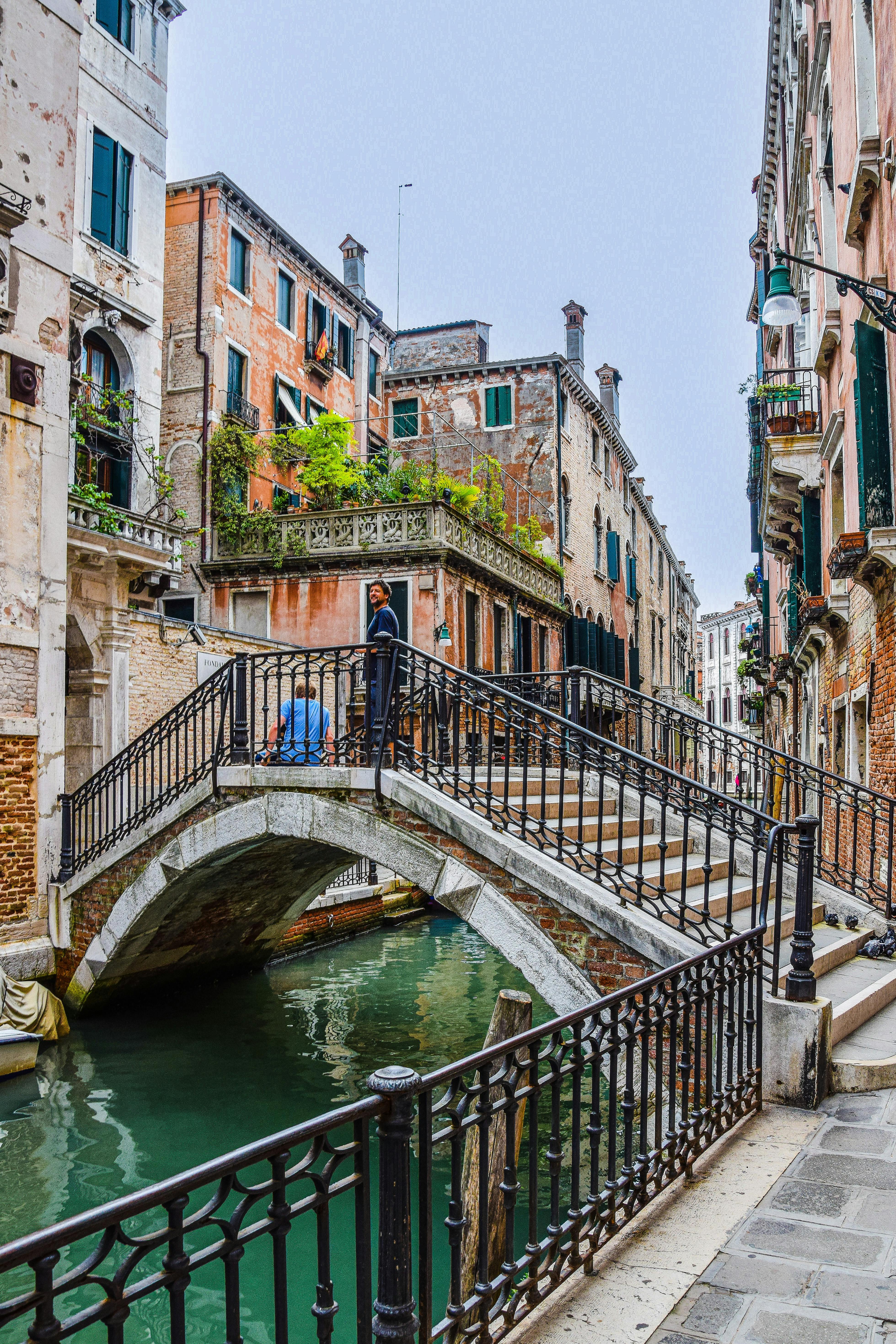 View of an Arch Bridge over the Canal and Houses in Venice, Italy ...