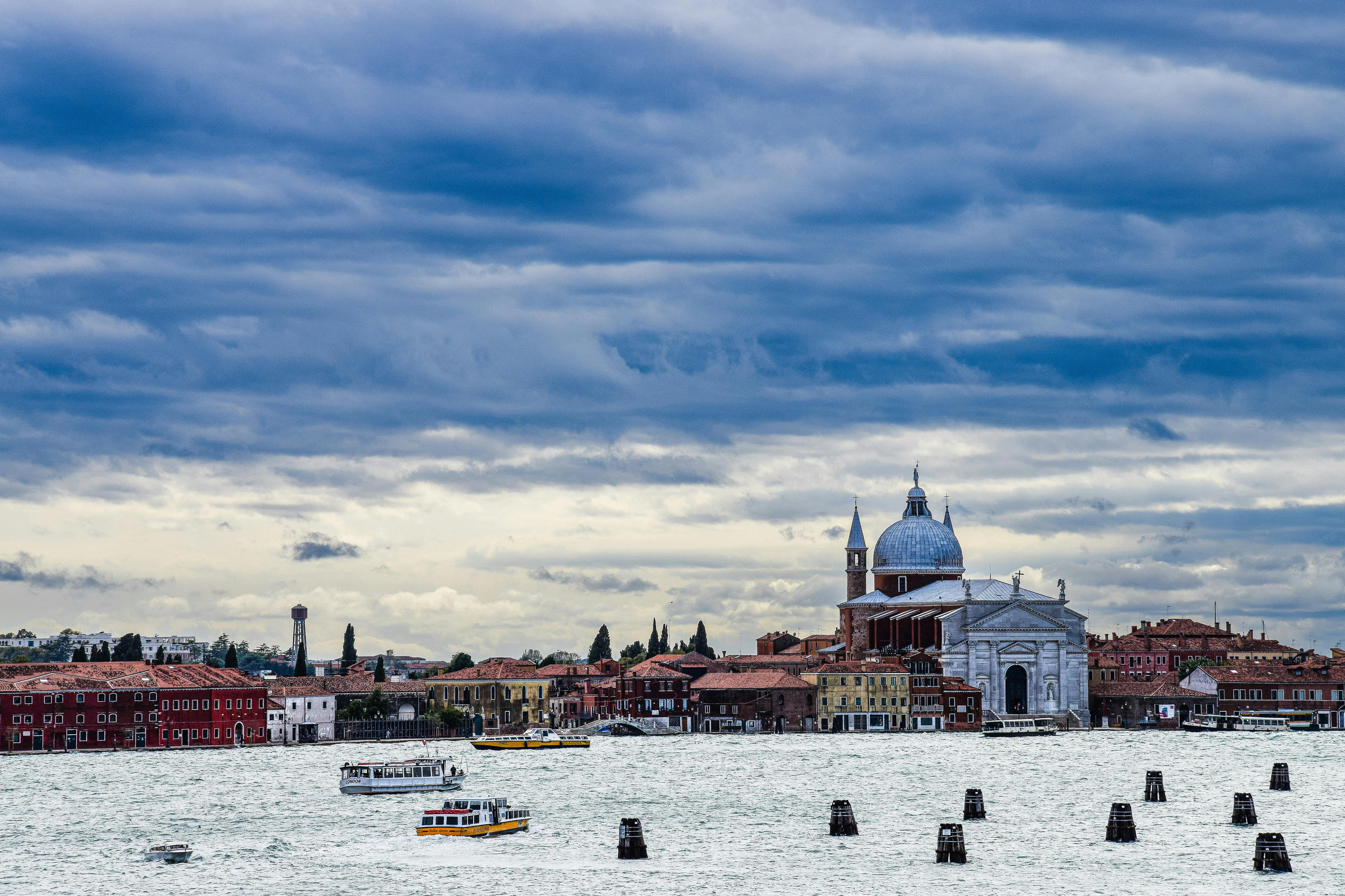 View of the Il Redentore and Canale della Giudecca under a Cloudy Sky ...