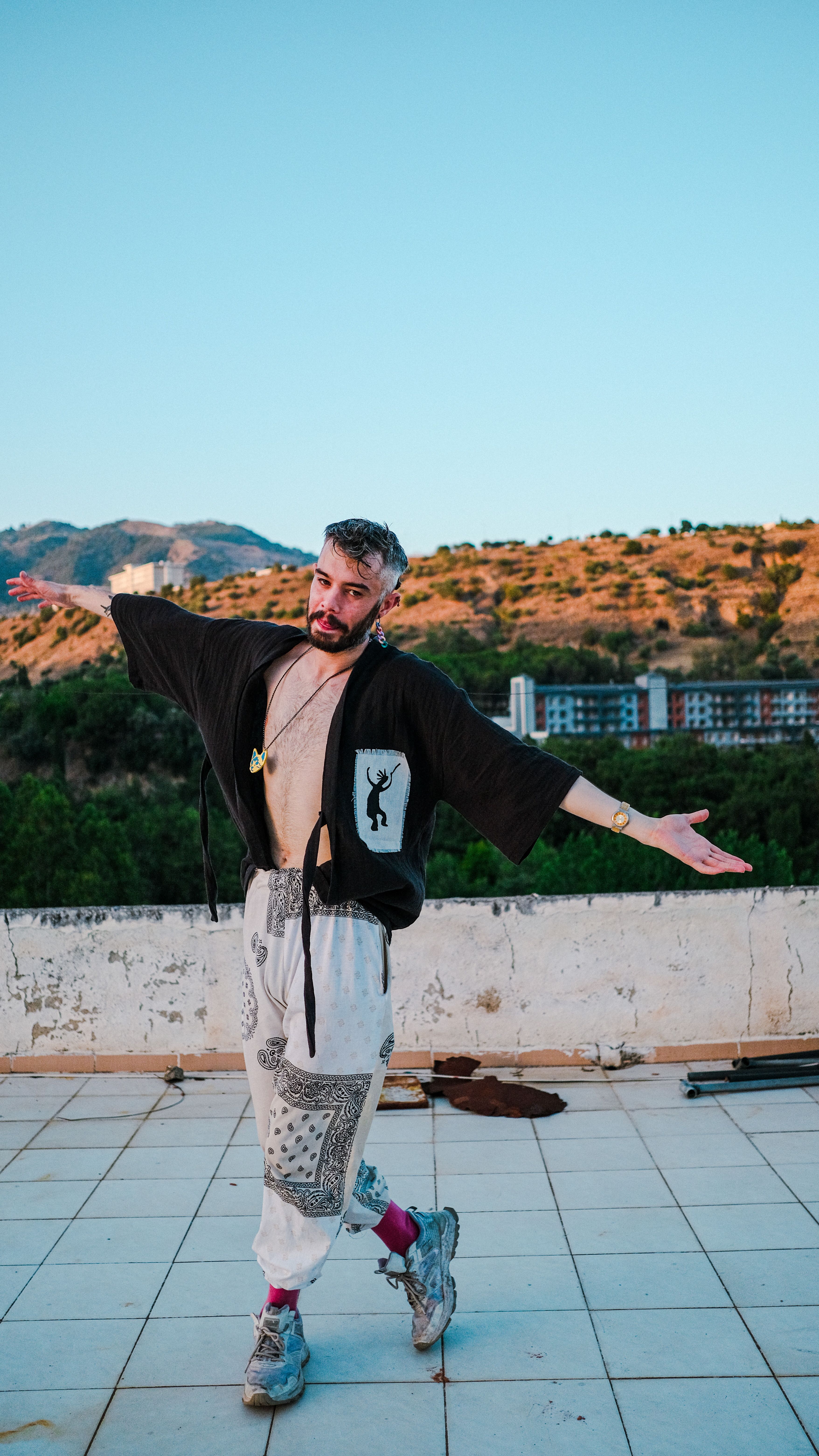 Bearded Man Dancing on Terrace · Free Stock Photo
