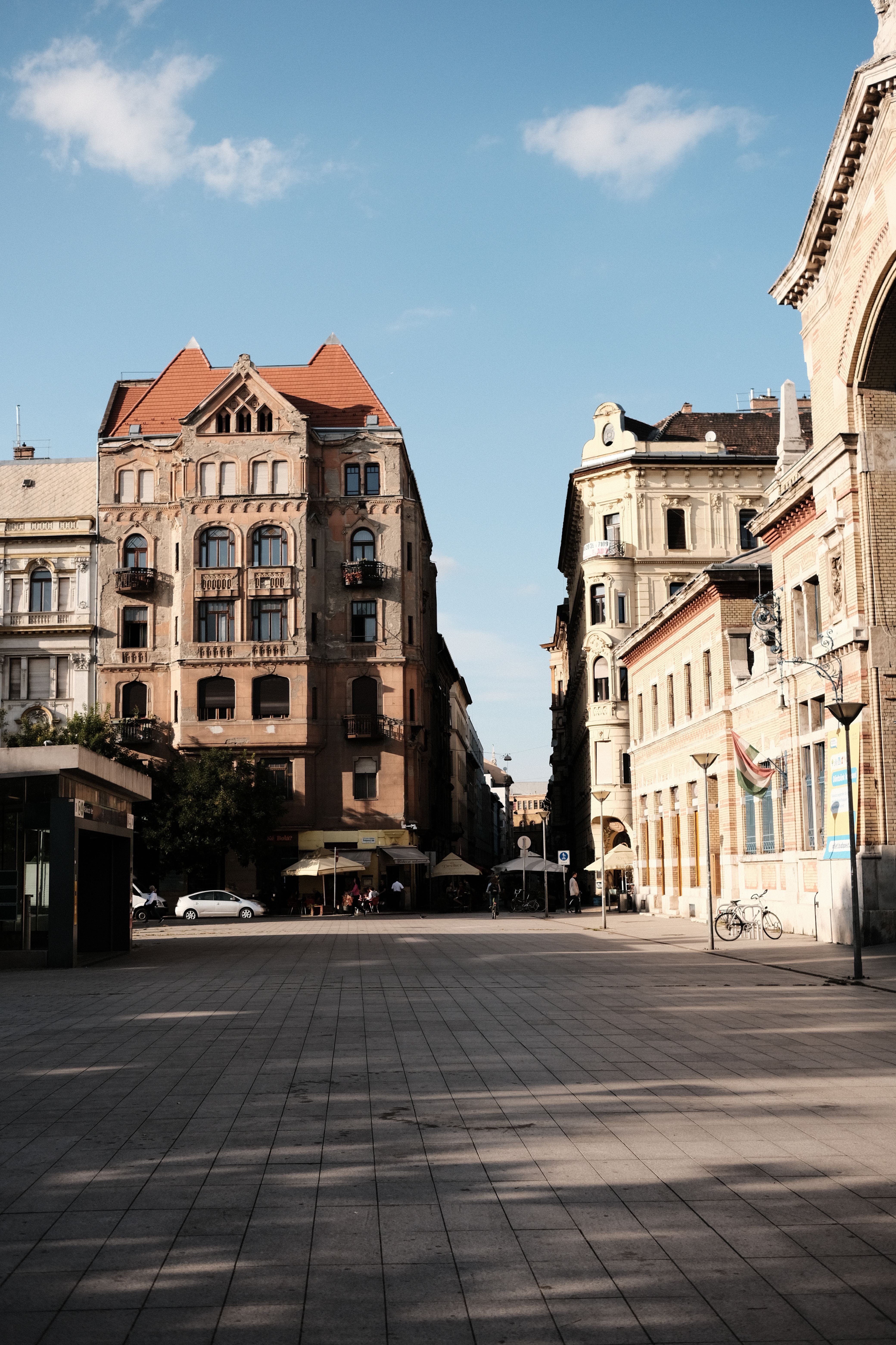 A city street with buildings and people walking · Free Stock Photo